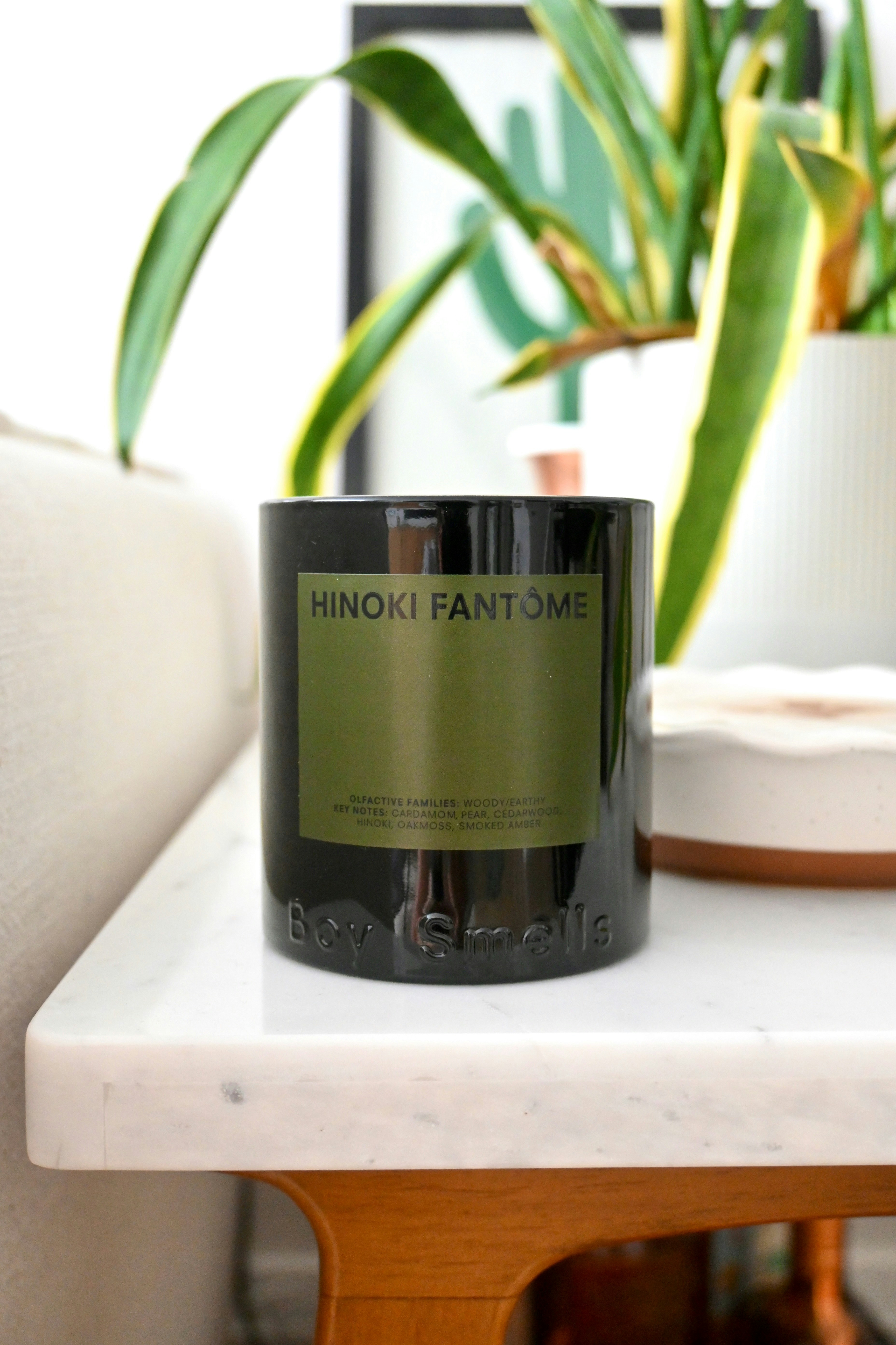 Midcentury Candle on Marble Table with Plant Backdrop