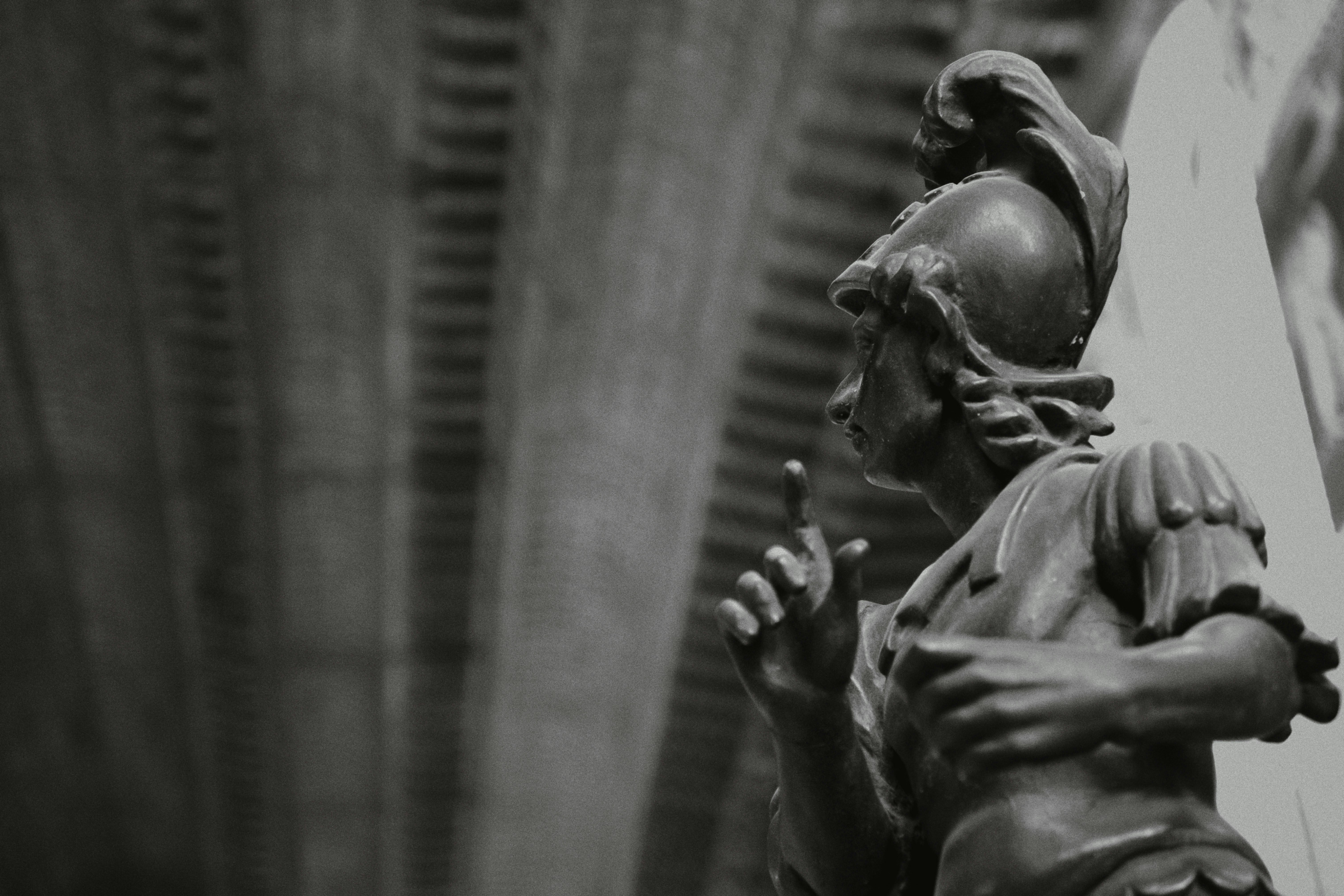 Whisper of Stone: A Cardinal Angel in Soft Focus