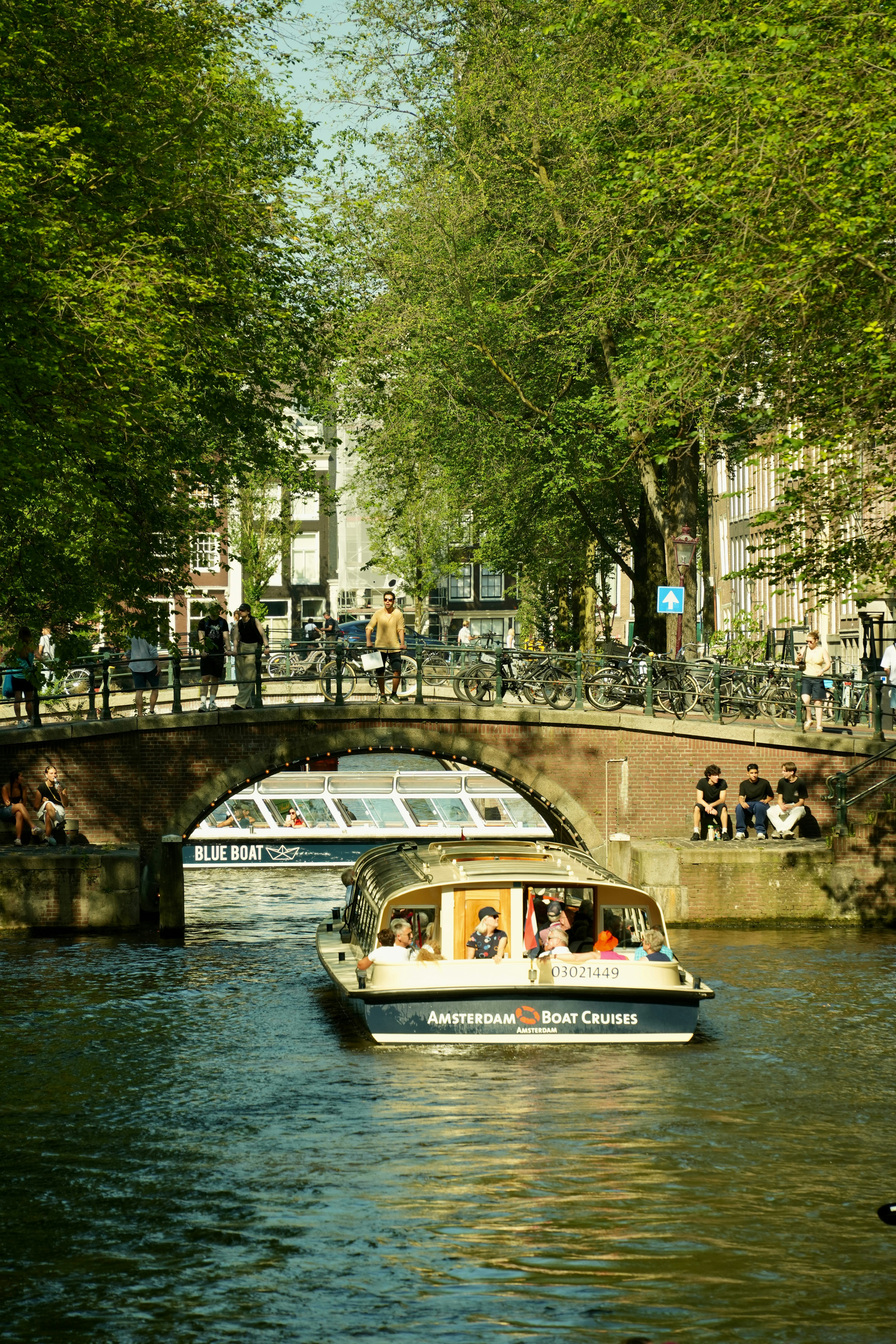 Cruise Under the Old Bridge: Amsterdam’s Canal Tour at Dusk