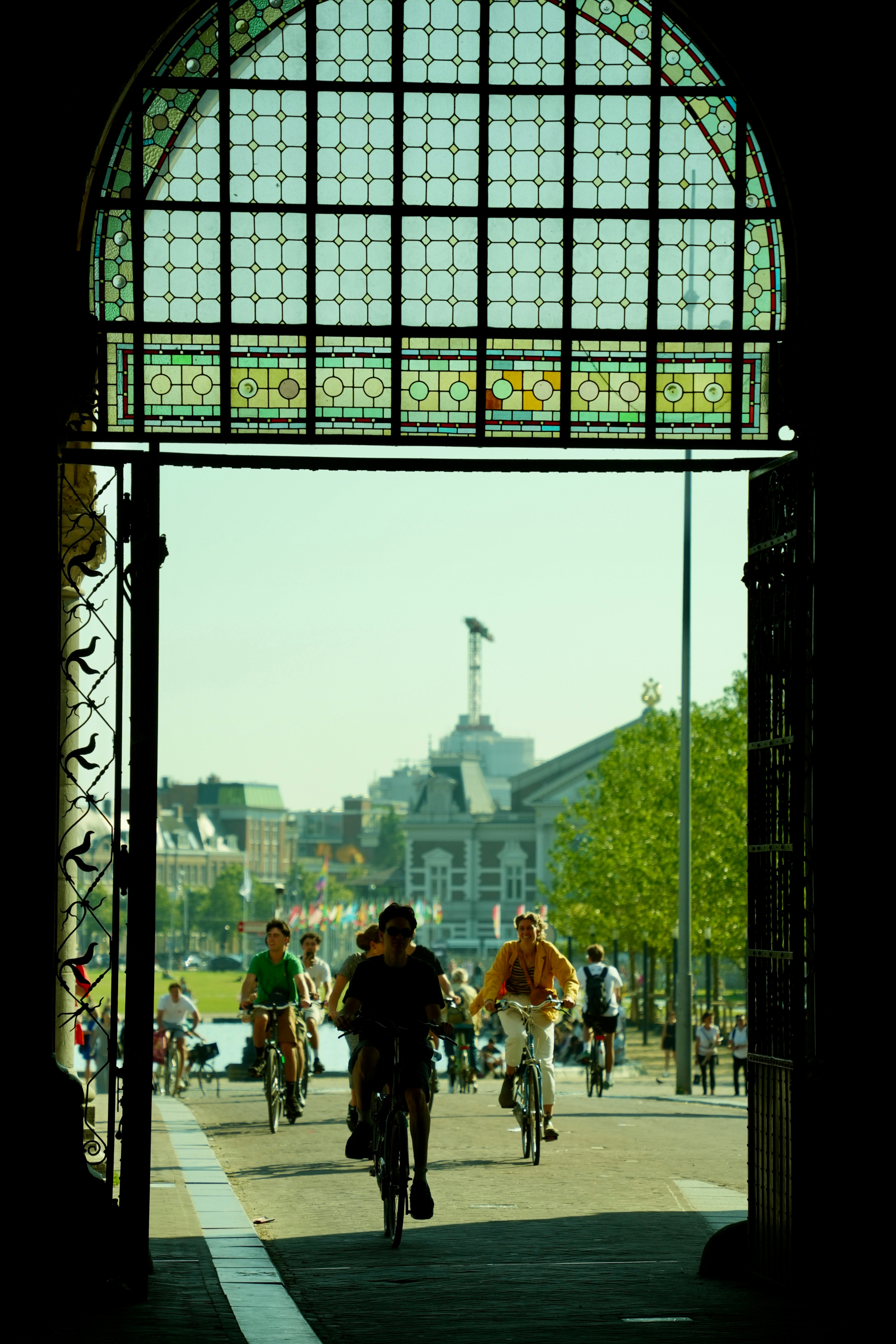 Riders Emerge from the Gilded Arch into the City Dawn