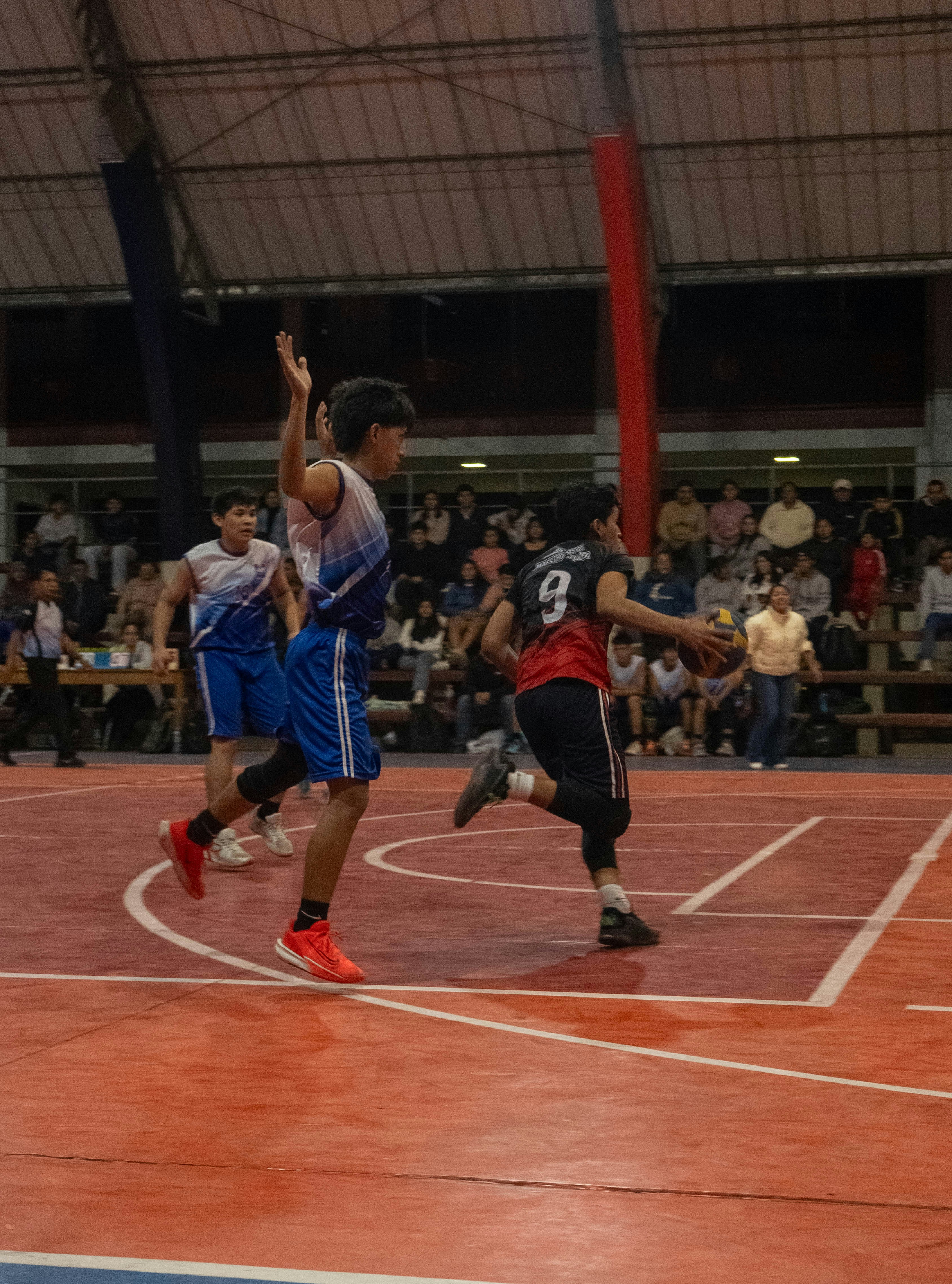Midcourt Sprint: A Rivalry in Red and Blue