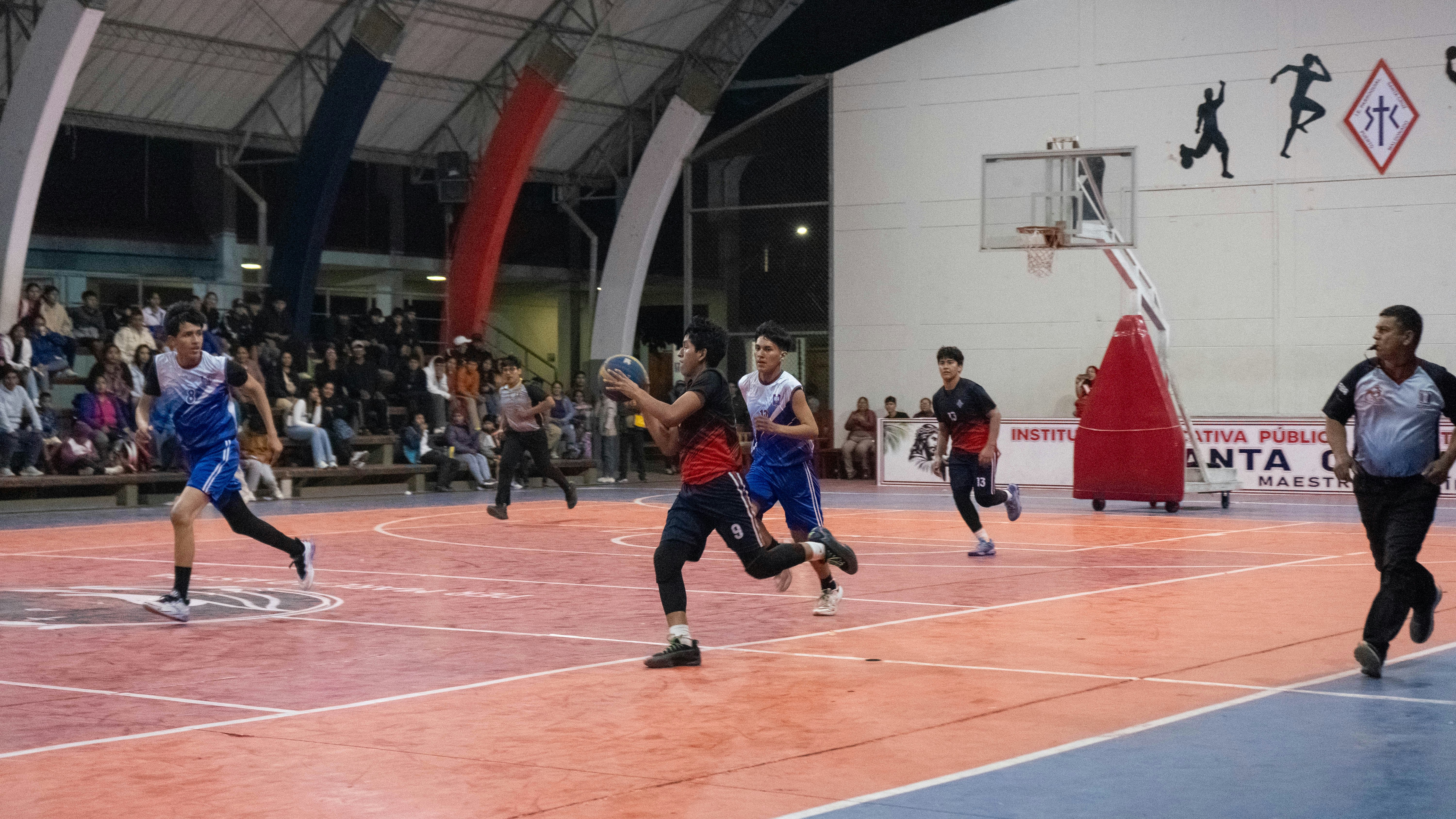Runners on Court: A Fast-Paced Moment of a Street-Style Basketball Rally