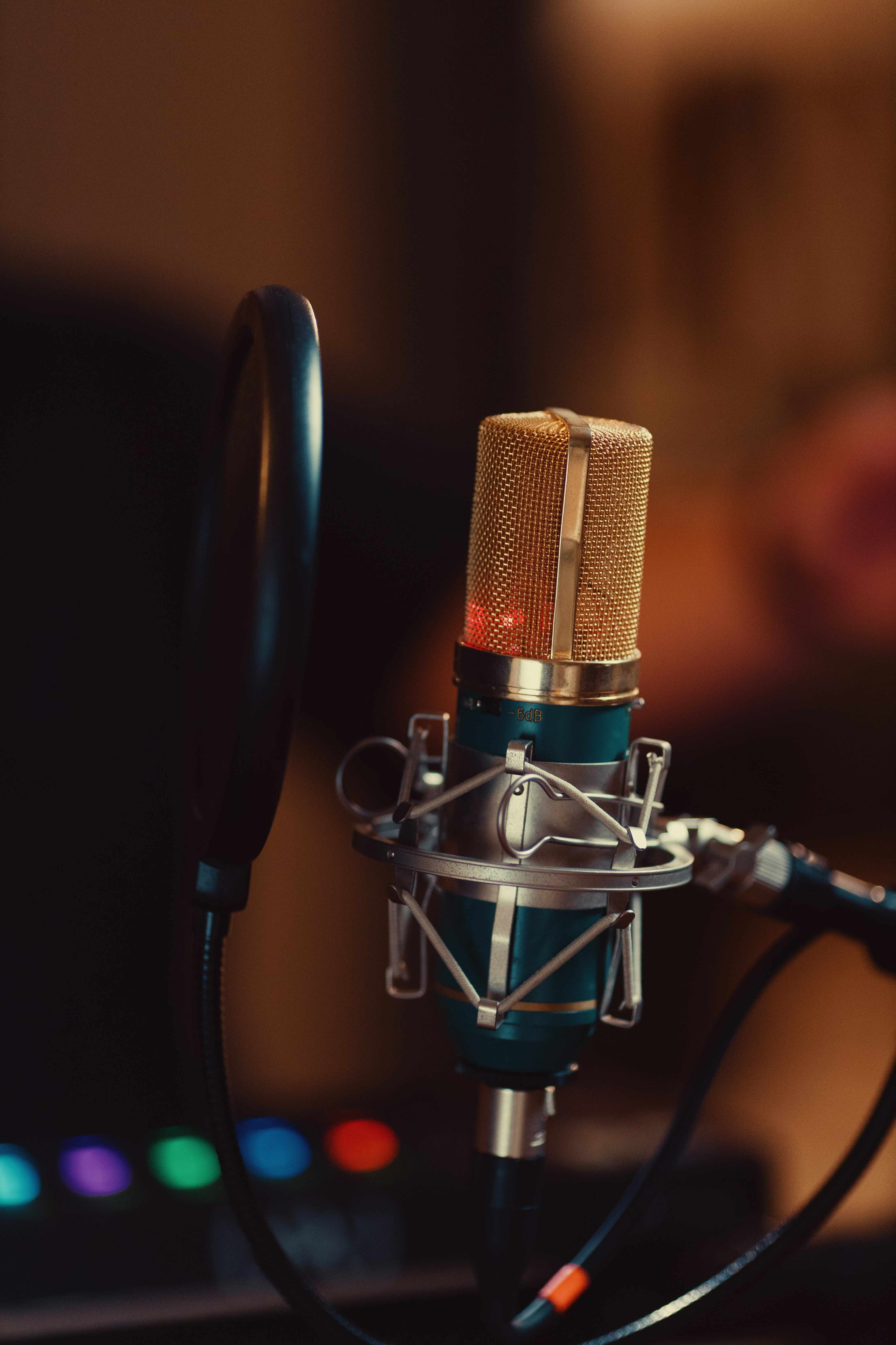 In the Booth: A Vintage Mic Centered in Warm Studio Glow
