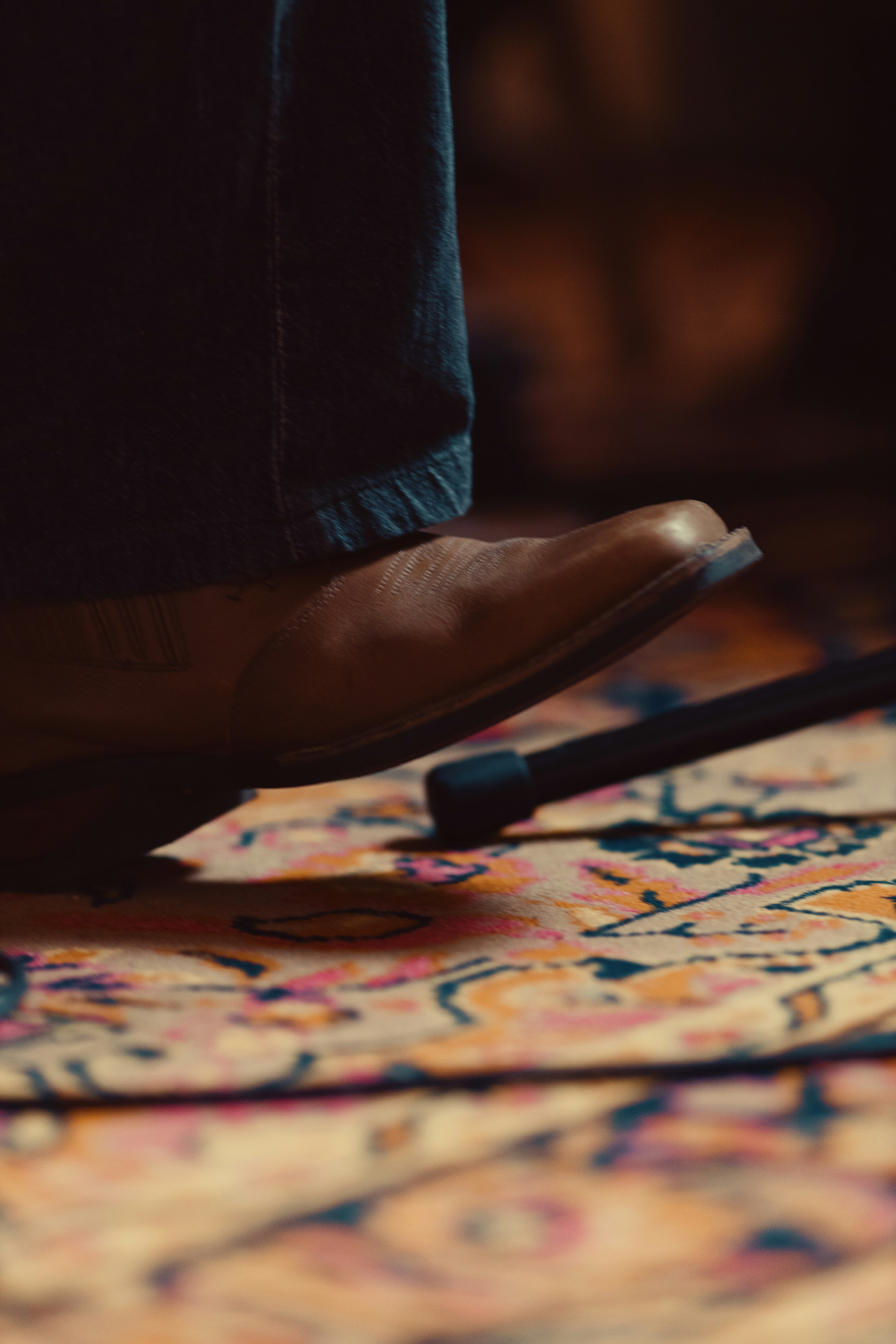 Step into the Threshold: A Footstep on a Colorful Rug
