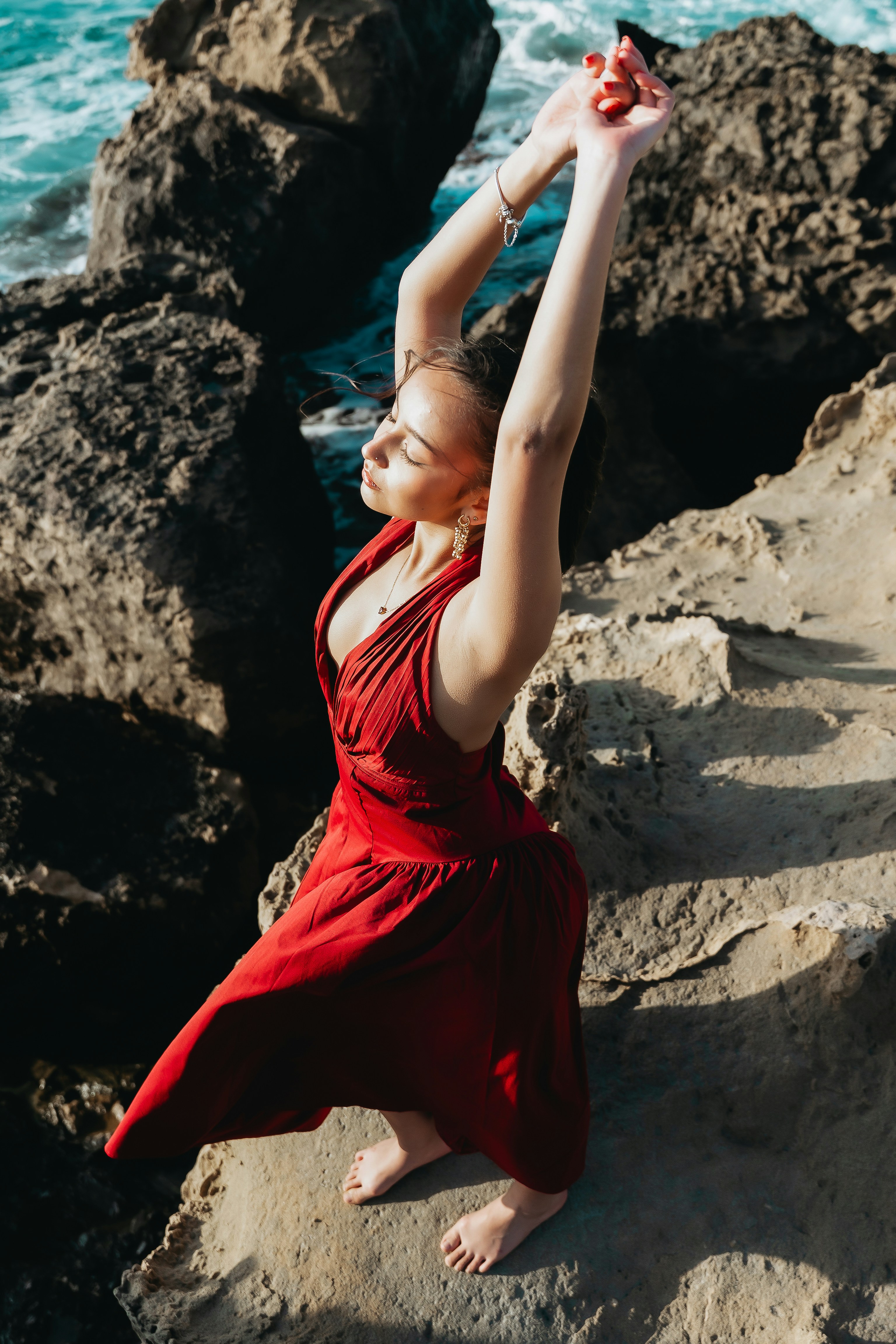 Crimson Dress, Ocean Cliff: A Dance Above the Tide