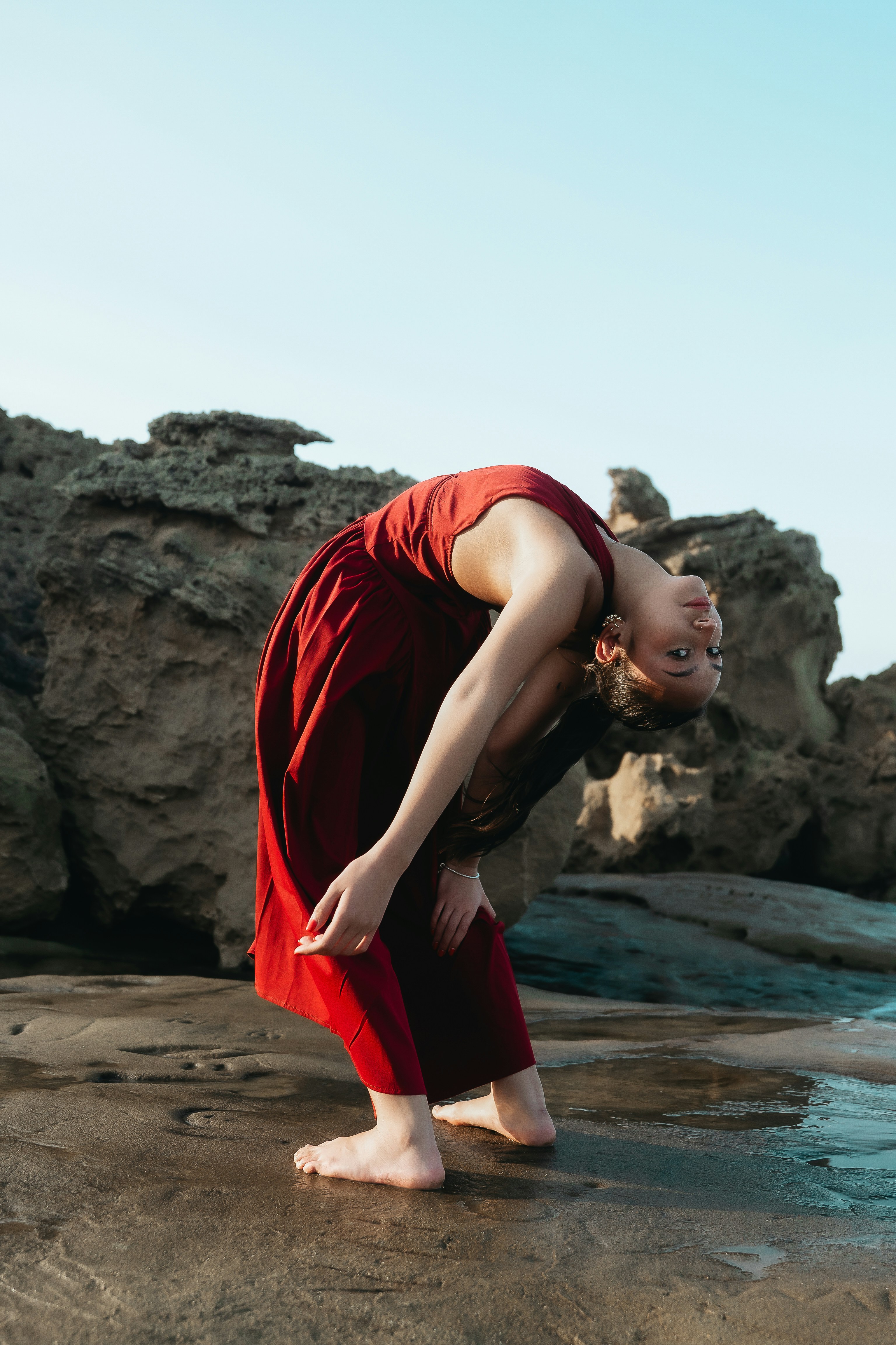 Graceful Backbend on Weathered Shoreline