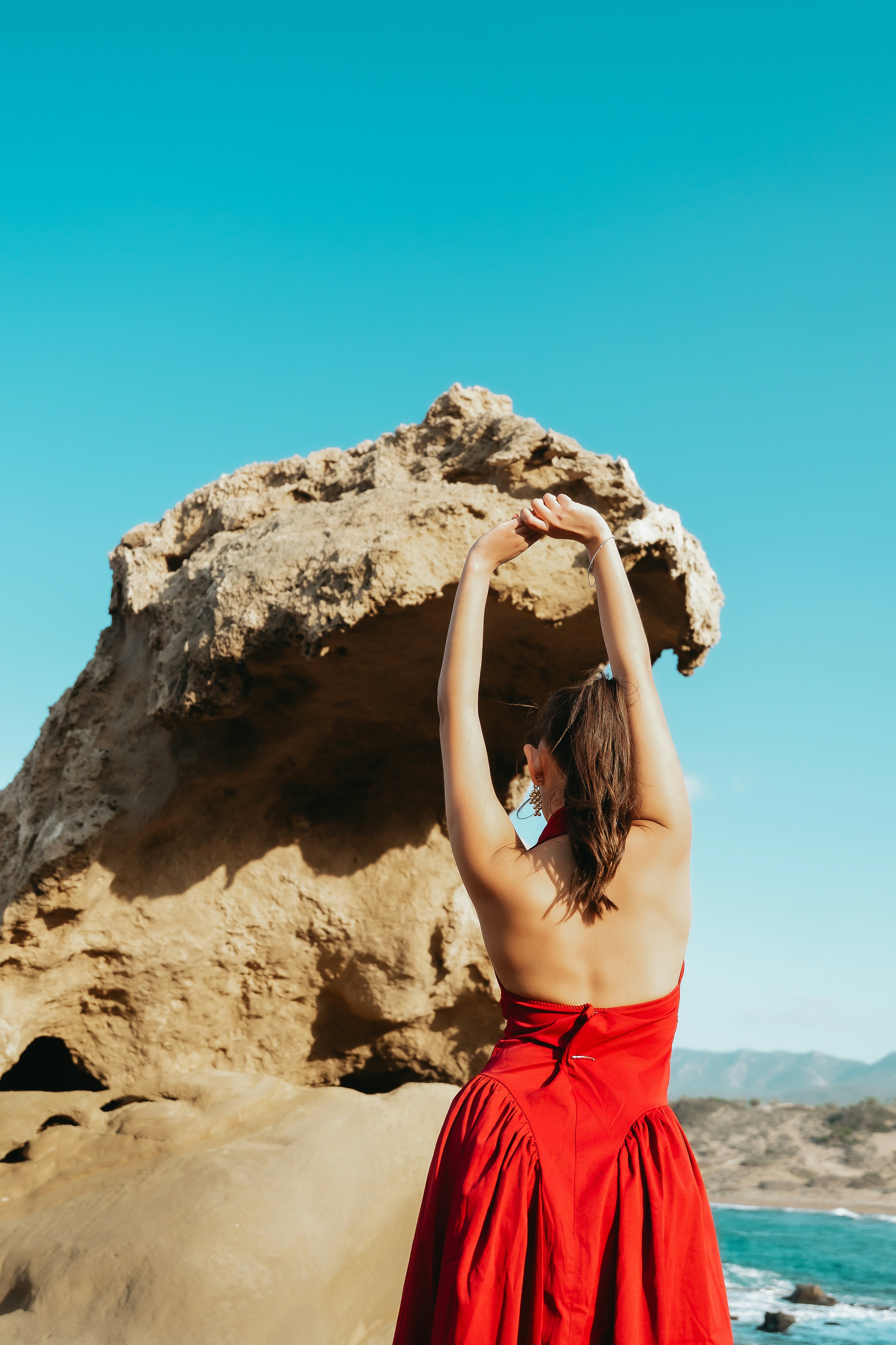 Red Dress at the Sea's Edge
