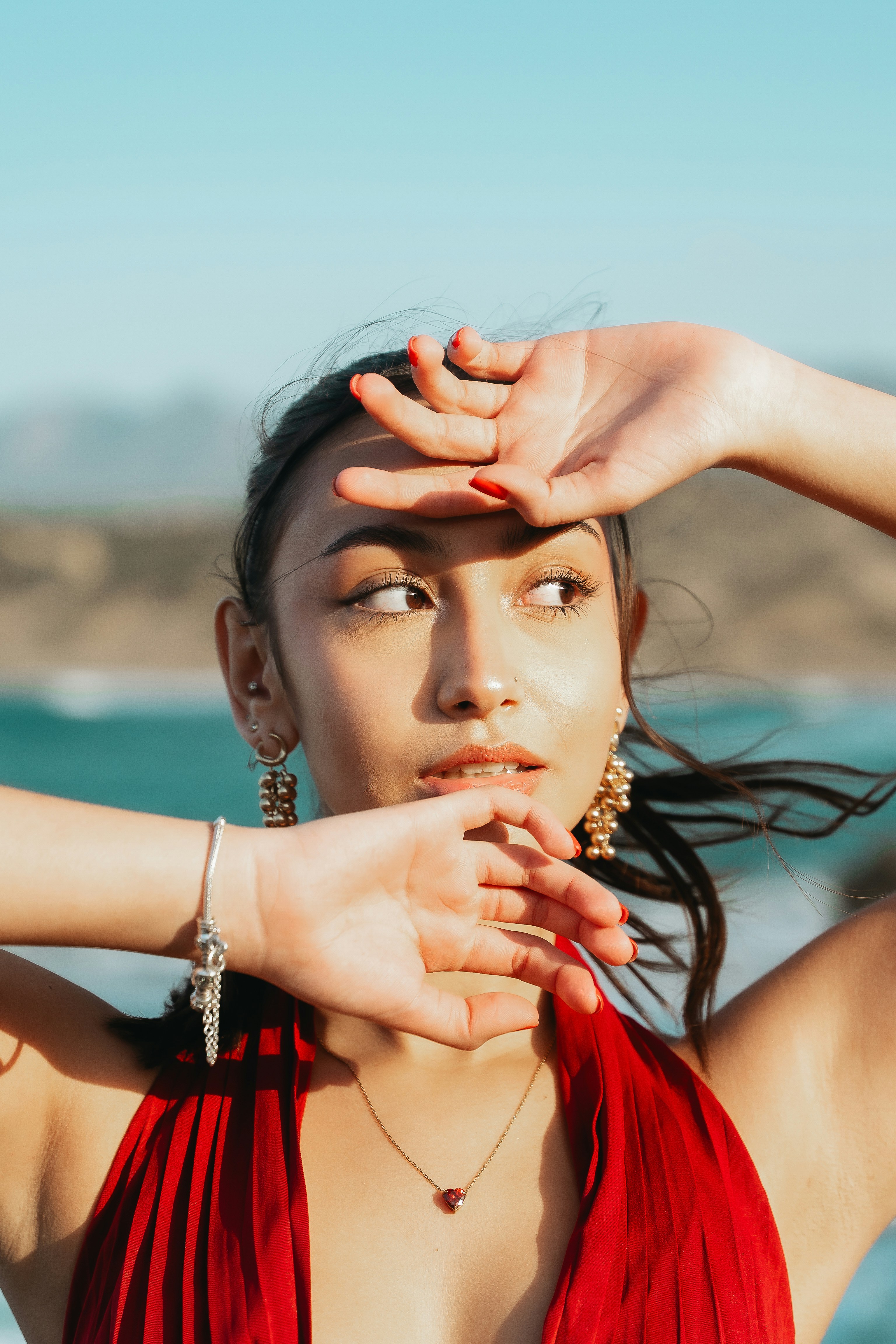 Sunlit Veil: A Portrait of Hidden Gaze and Red Fabric