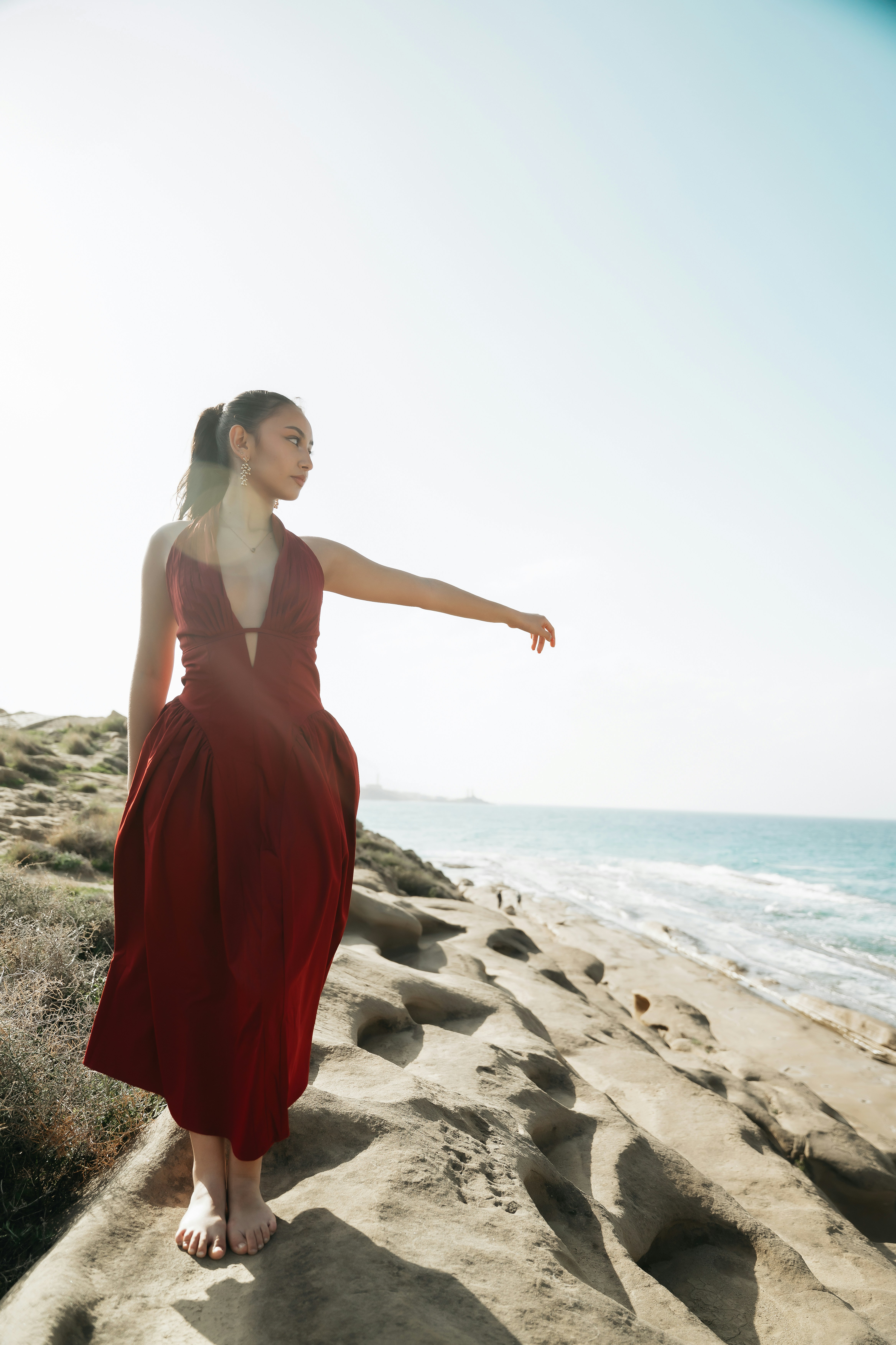 Reddress on the Rim: A Figure at Sea Cliff