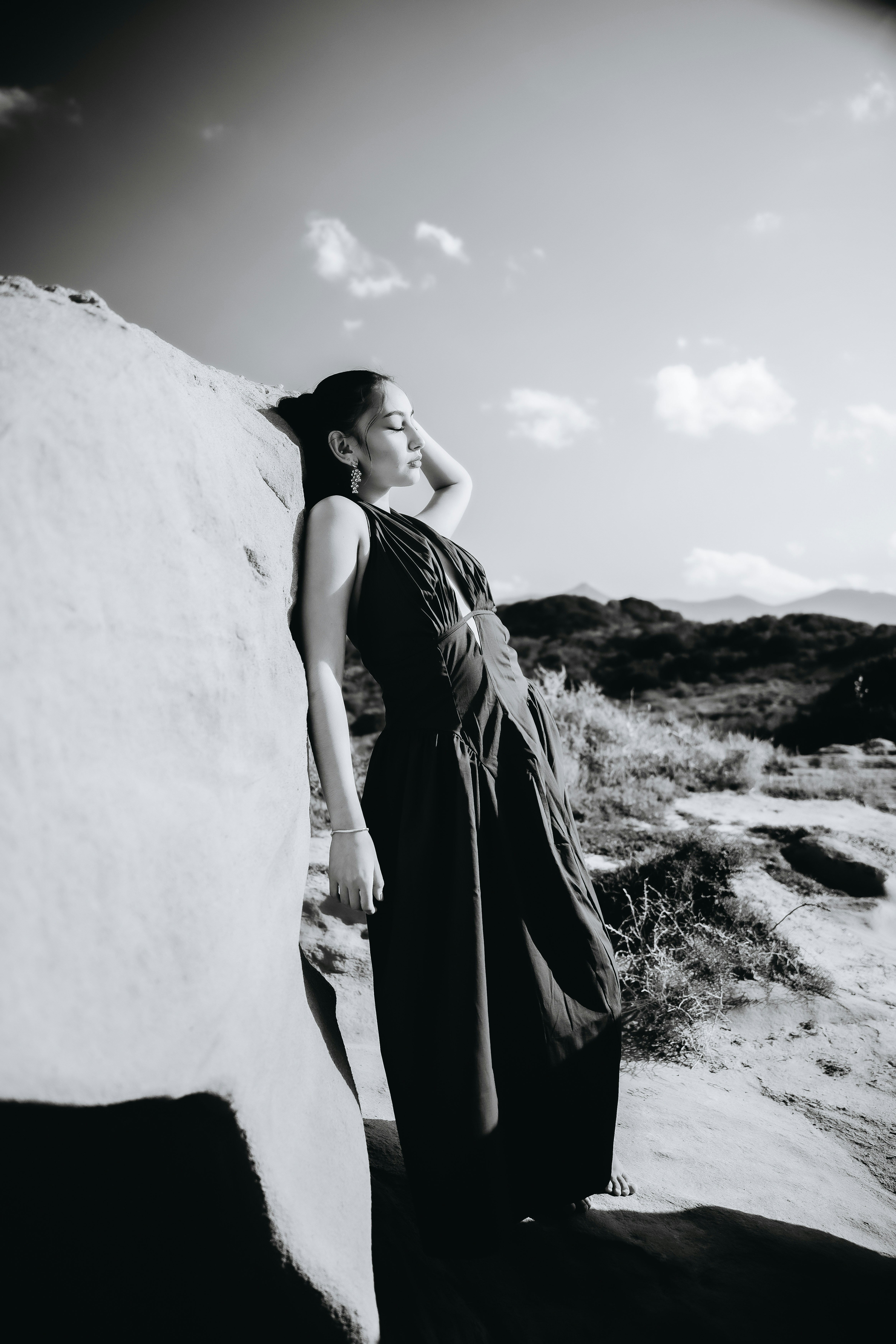 Portrait at the Edge: A Figure in Shadowed Light Against Desert Rock