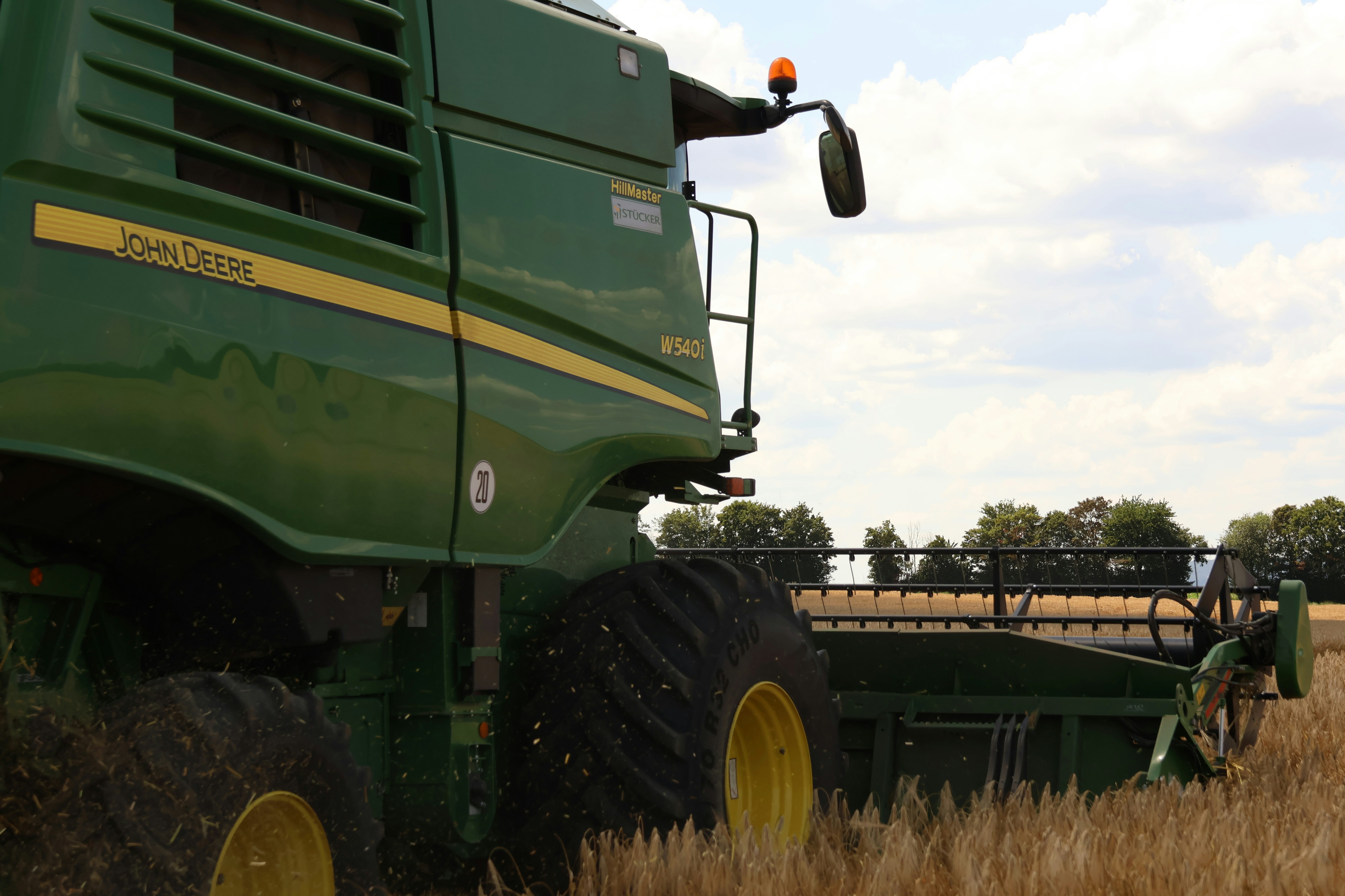 Green Giant in the Field: A John Deere Harvester at Golden Hour