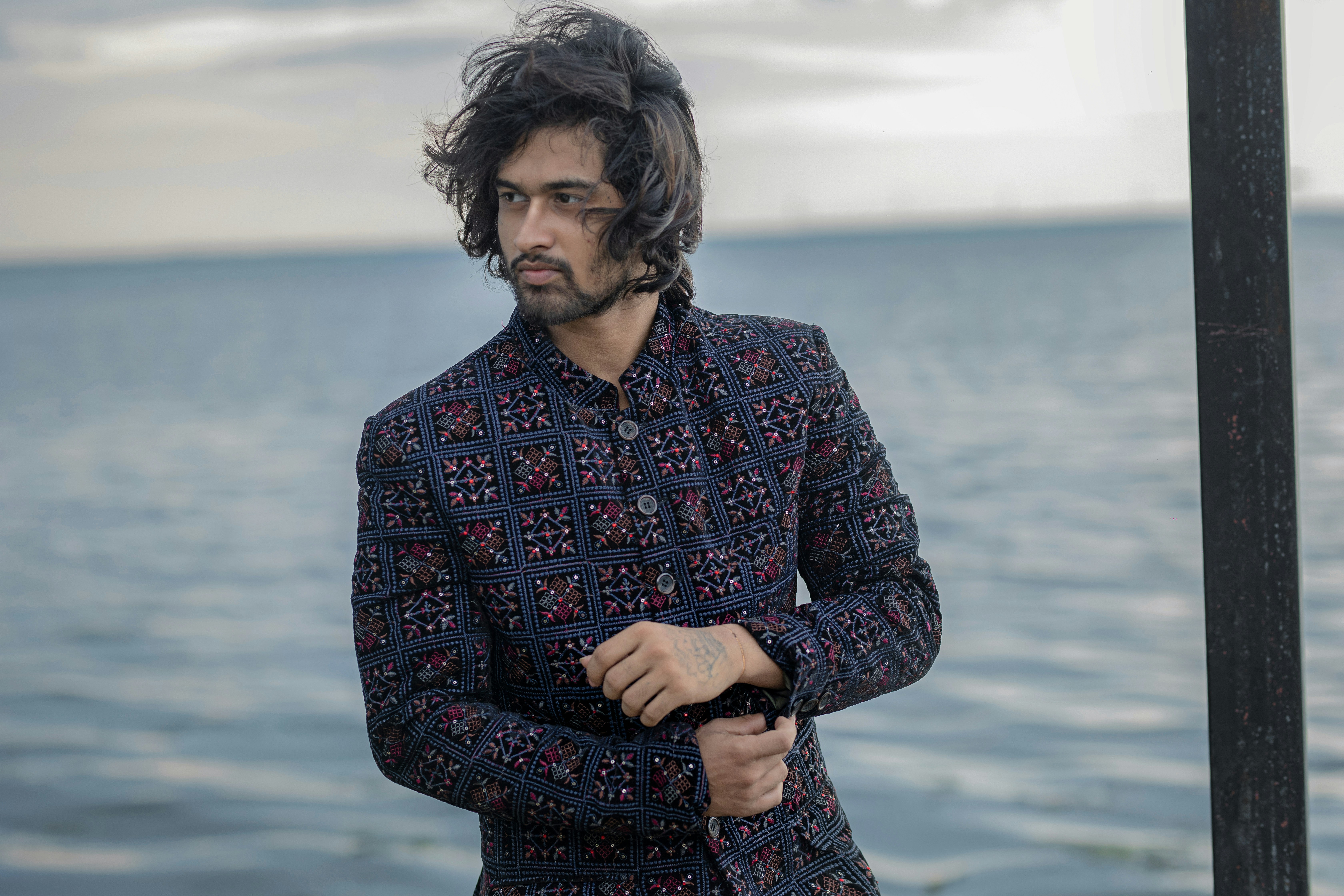  patterned dusk by the sea: a contemplative portrait against a tranquil horizon