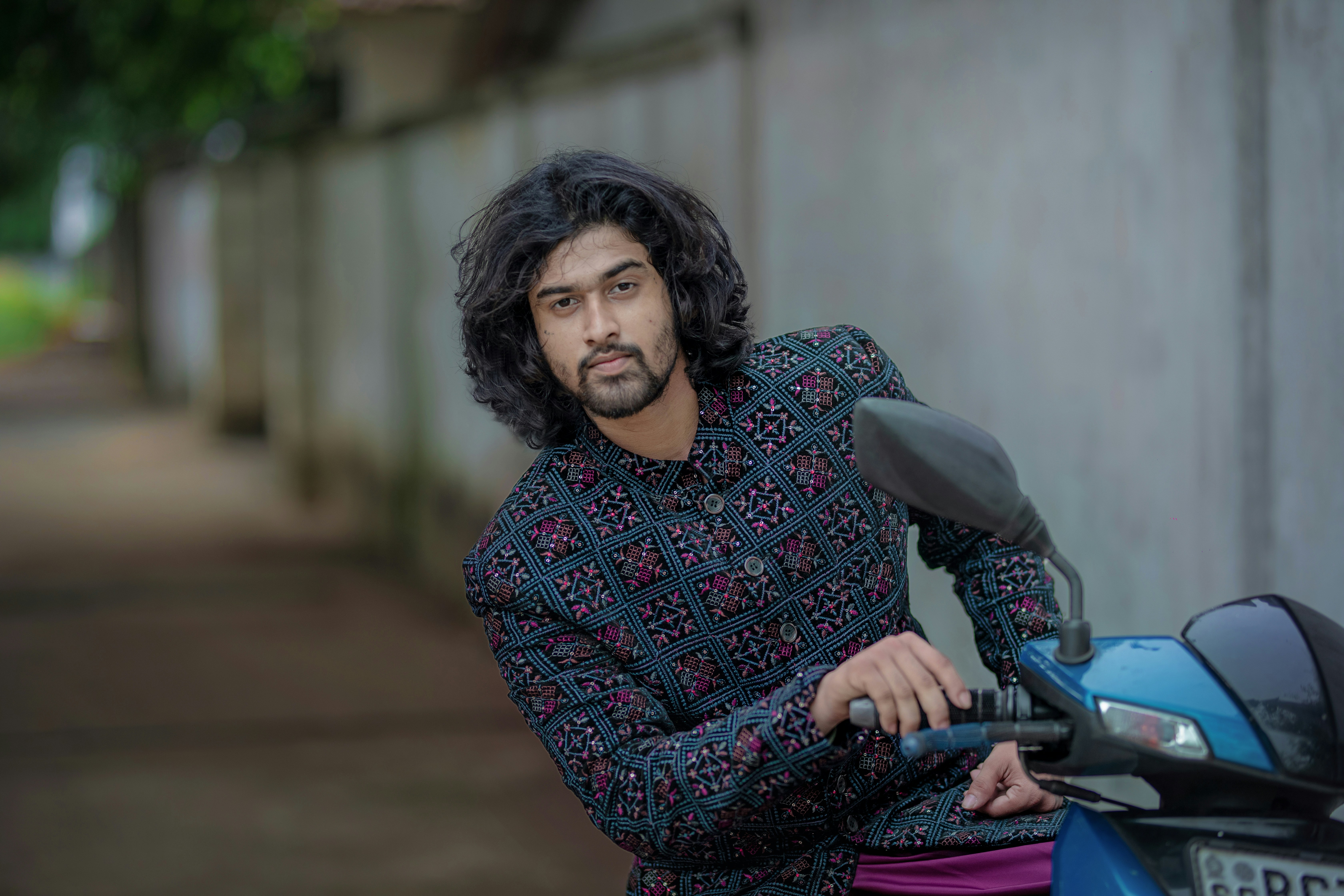Motorcycle by the Wall: Portrait in a Colorful Pattern