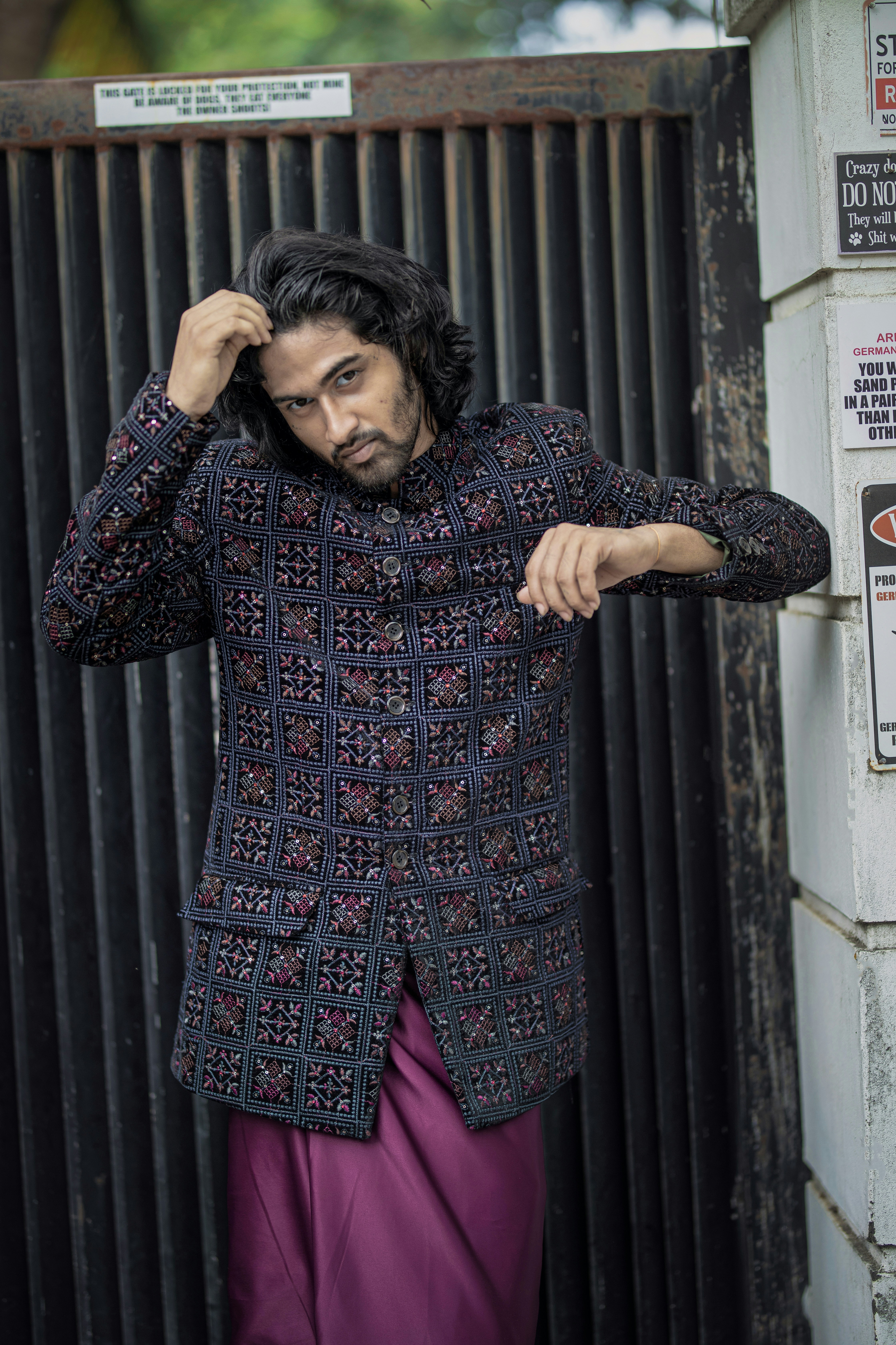 Patterned Poise: A Dressed-Down Confrontation with a Gated Backdrop
