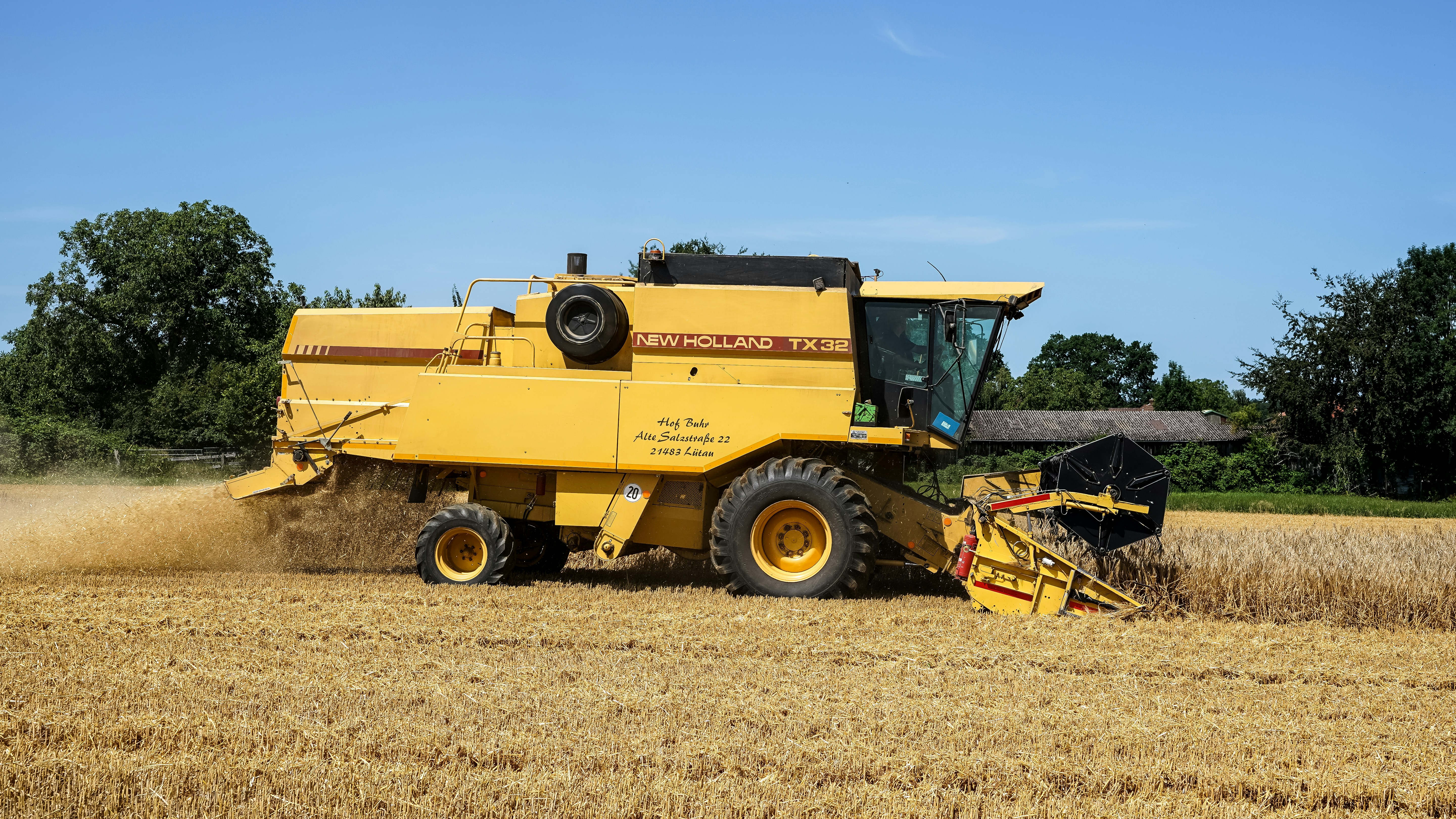 Golden Harvester in a Quiet Midday Field