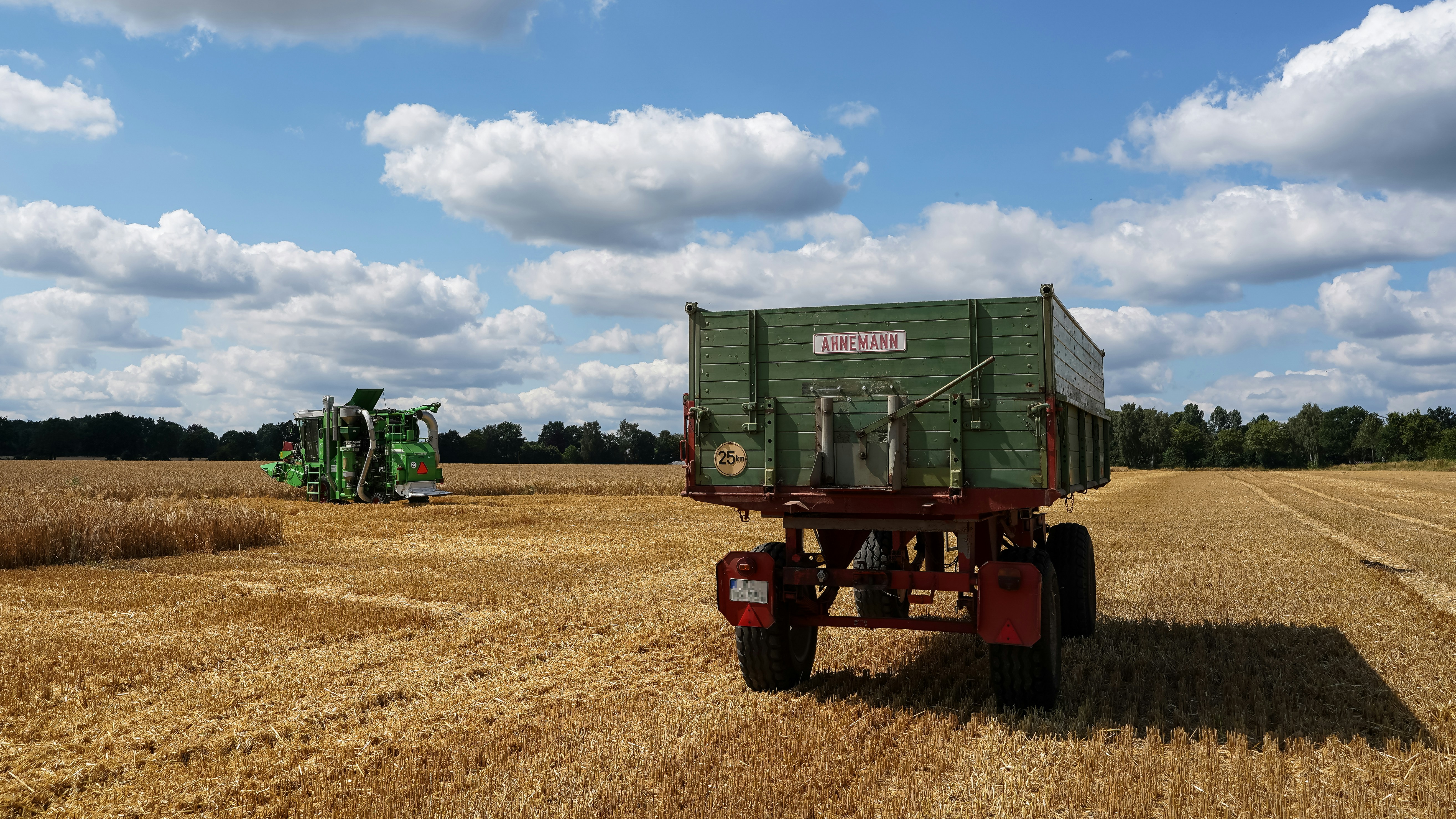 Harvest Road: The Green Combine at the Edge of the Field
