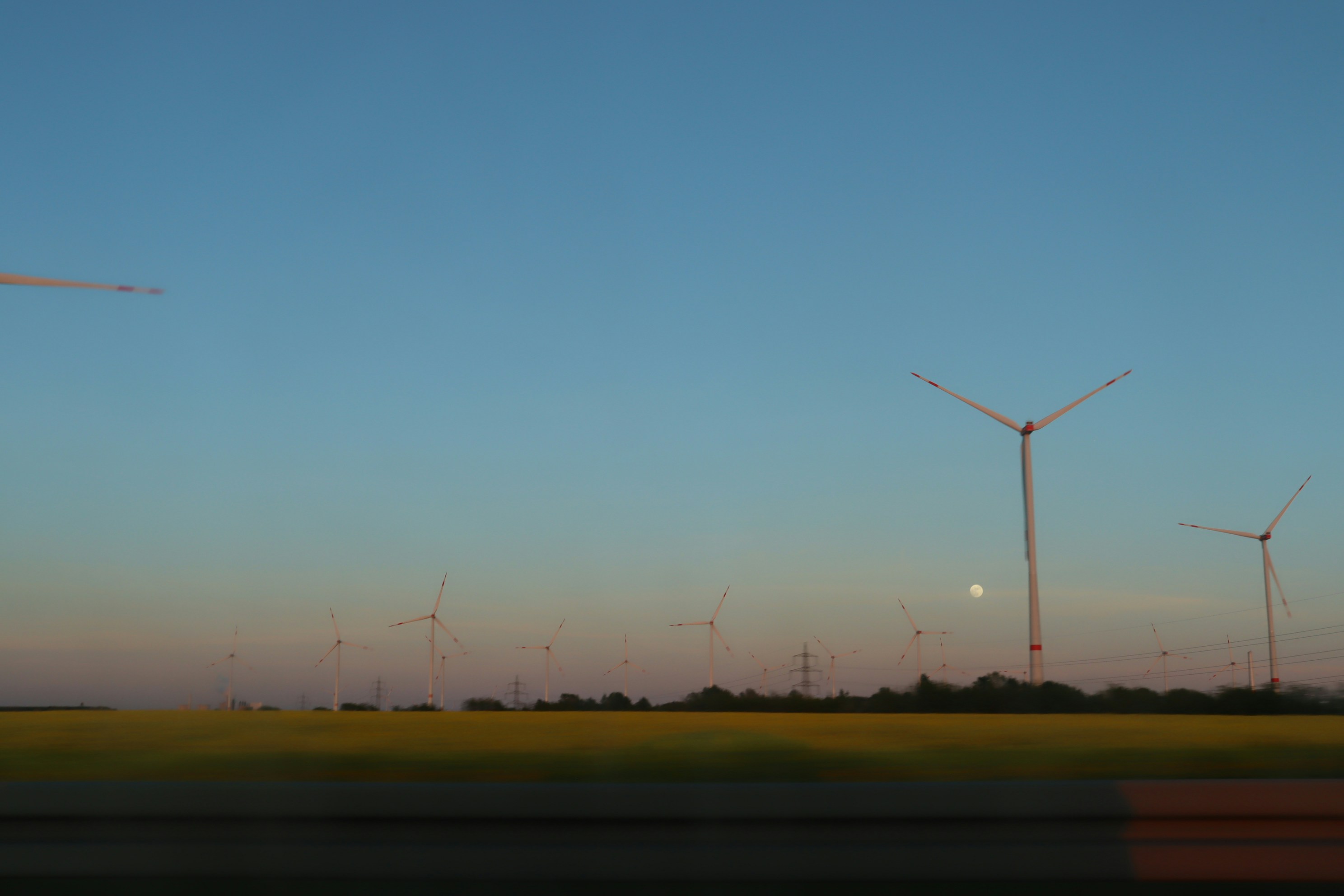 moon. twilight. wind turbines. the road. and a very early morning. | III