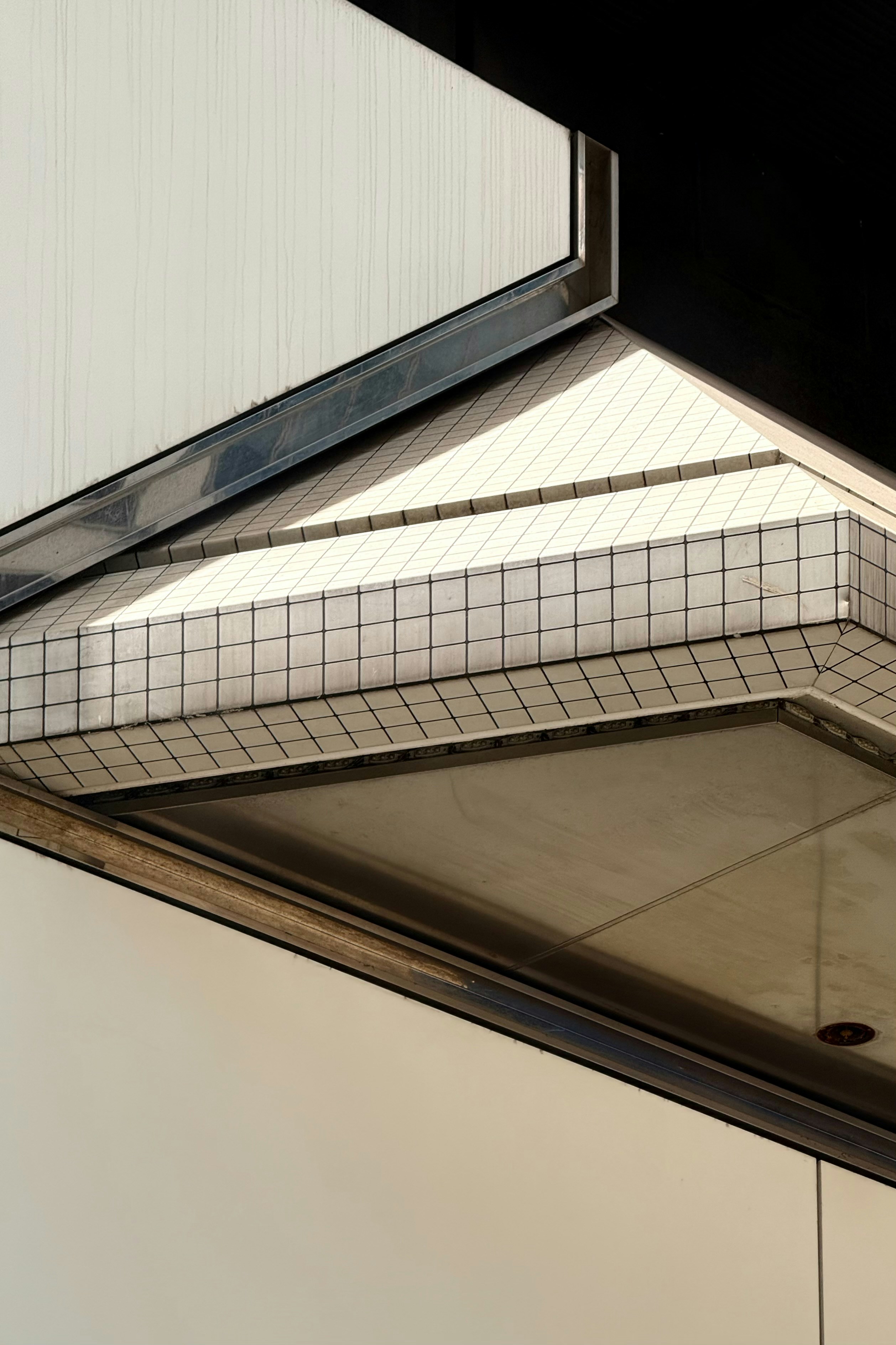 Angle of Tile and Light: A Geometric Facade