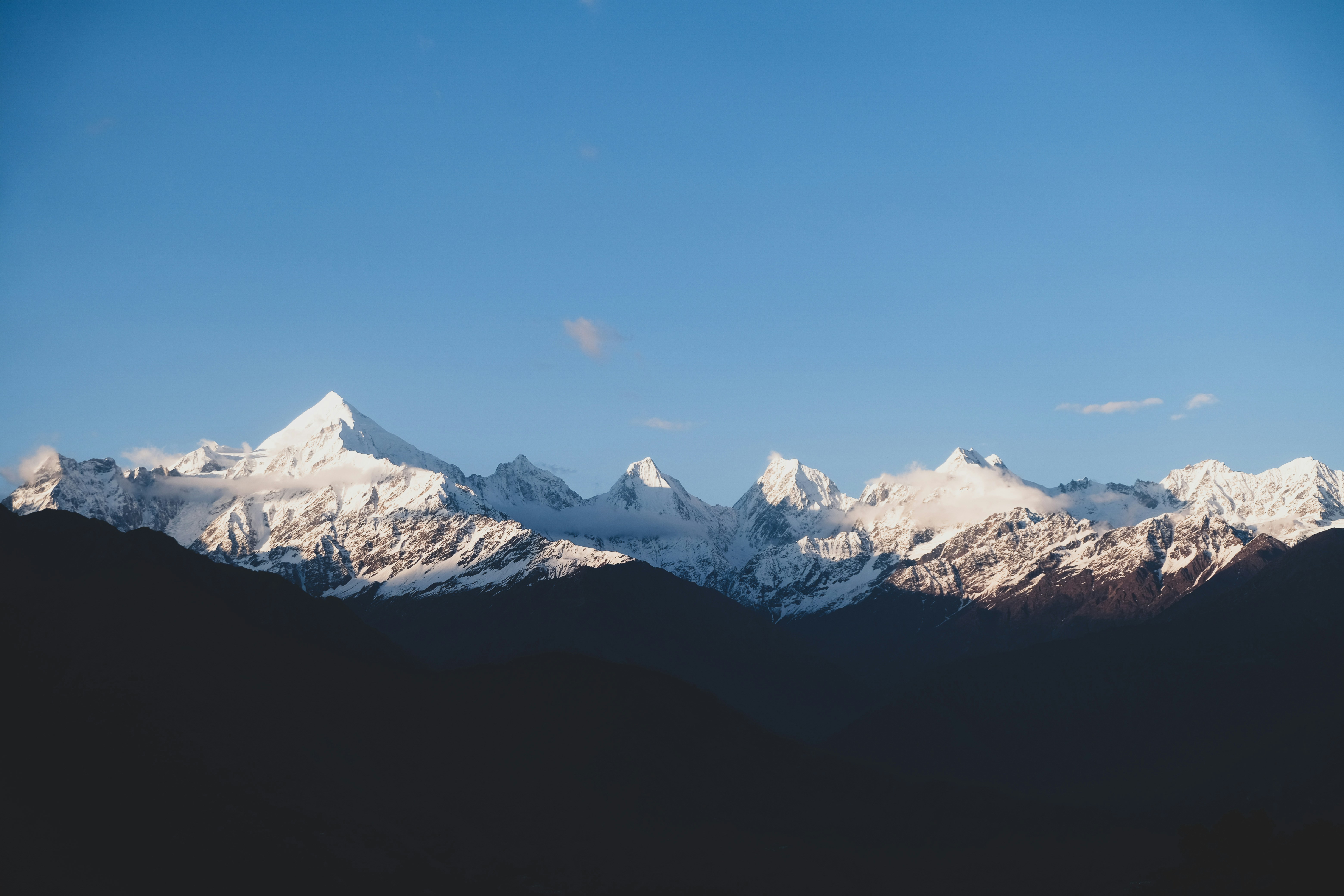 Snow-Capped Ridge Under a Clear Arctic Blue Sky
