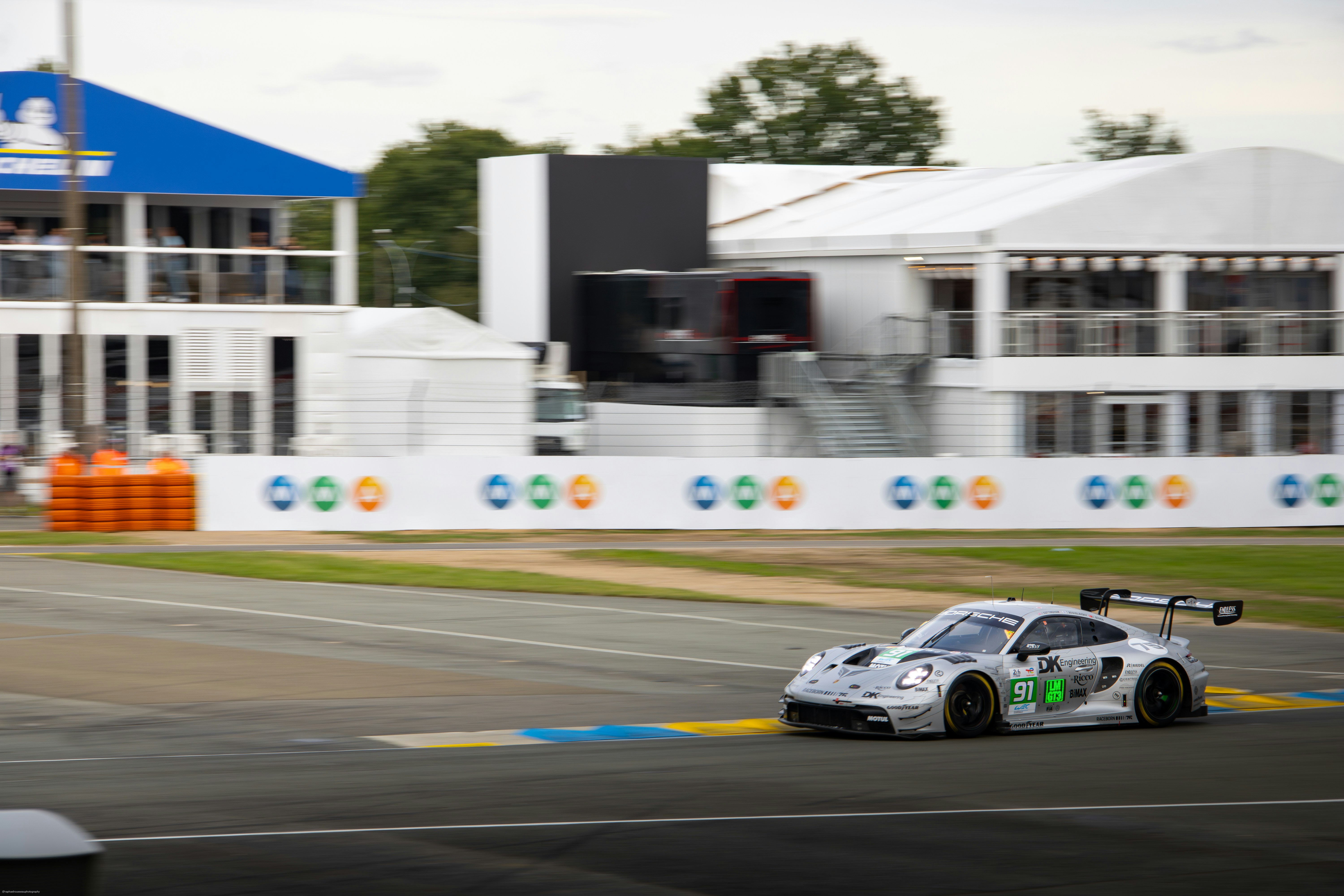 Silver Race Car Slices the Track at a Blur of Speed