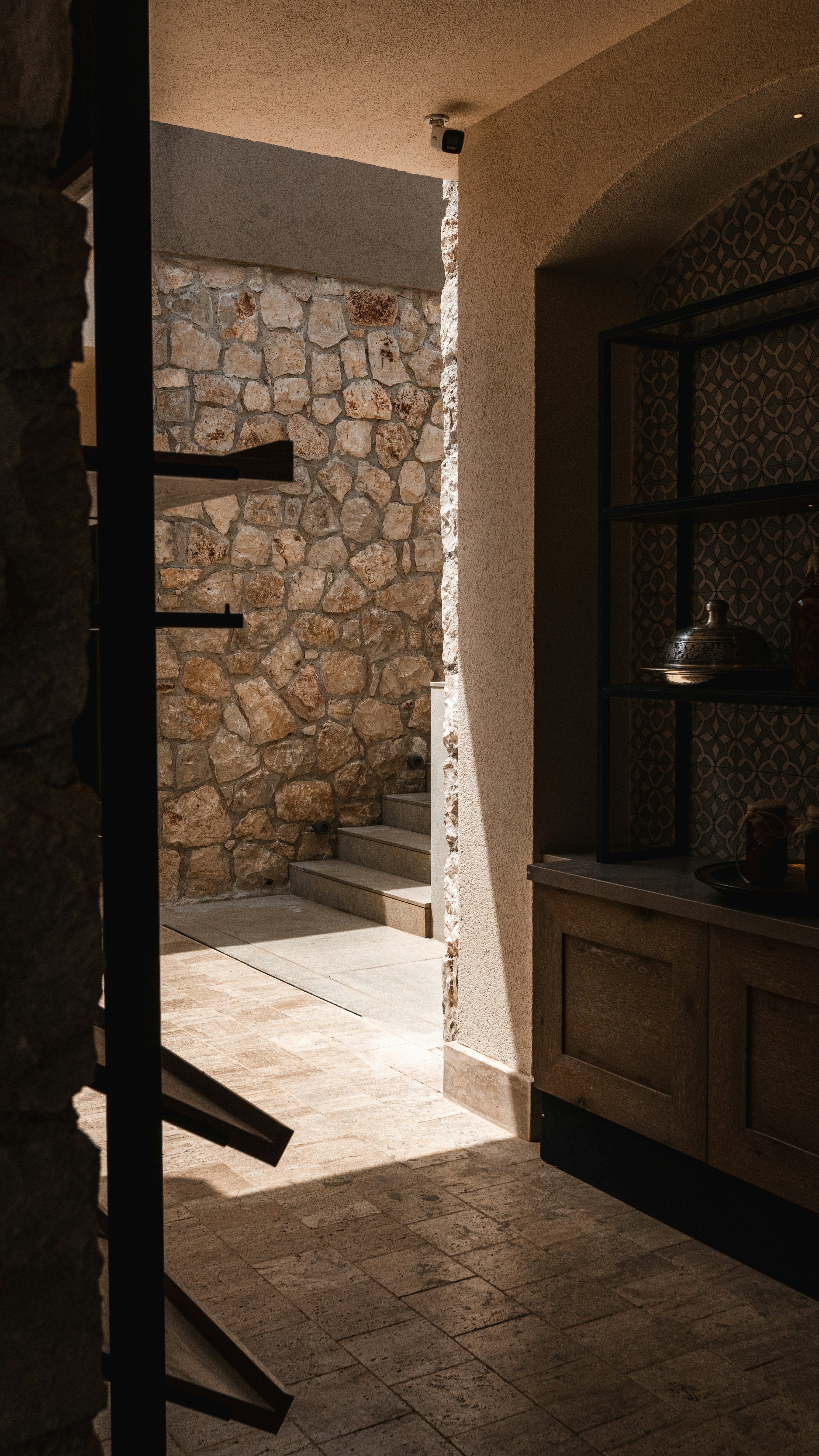 Sunlit Archway into Stone Courtyard