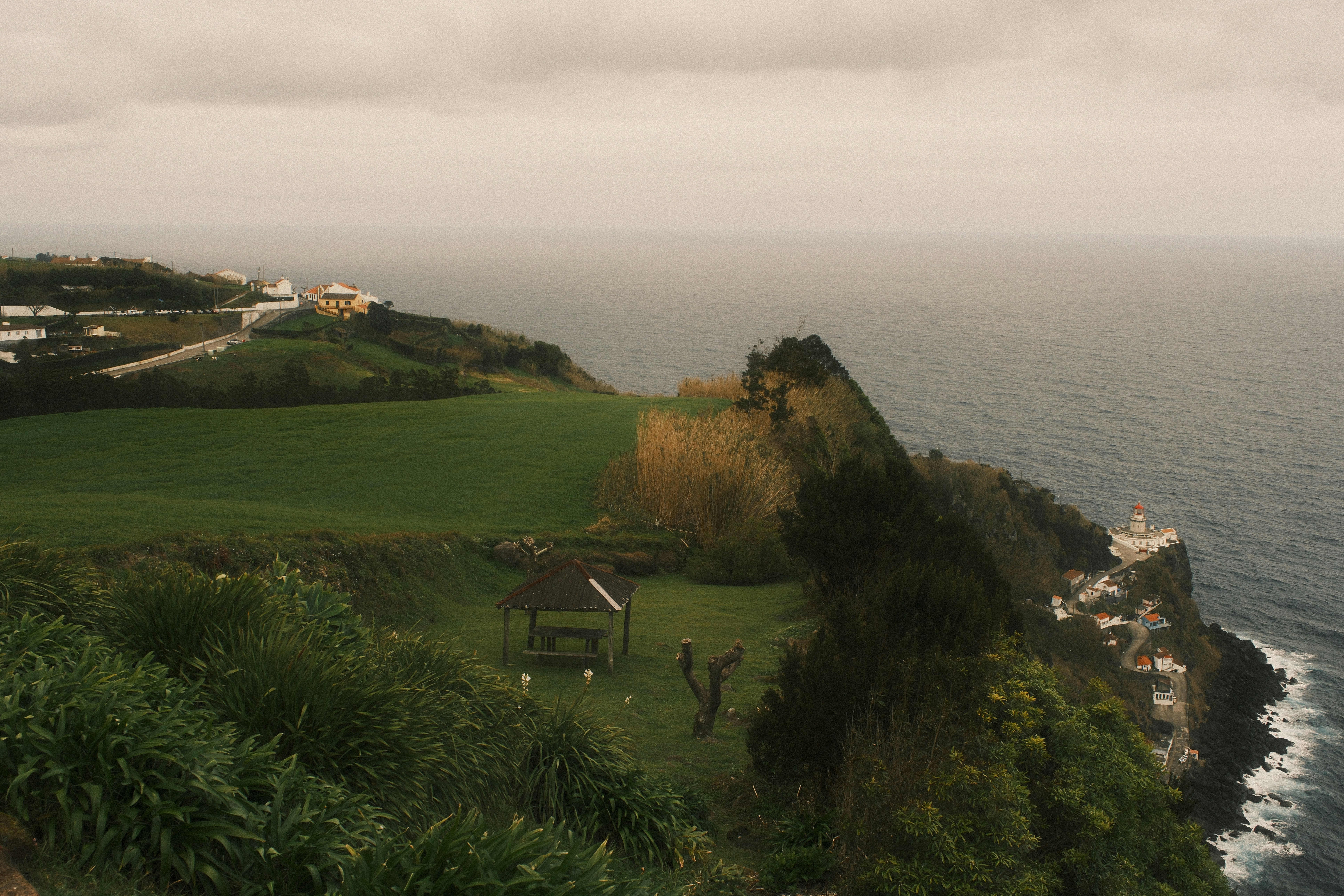 Clifftop Greens Overlooking a Sea-Swept Village