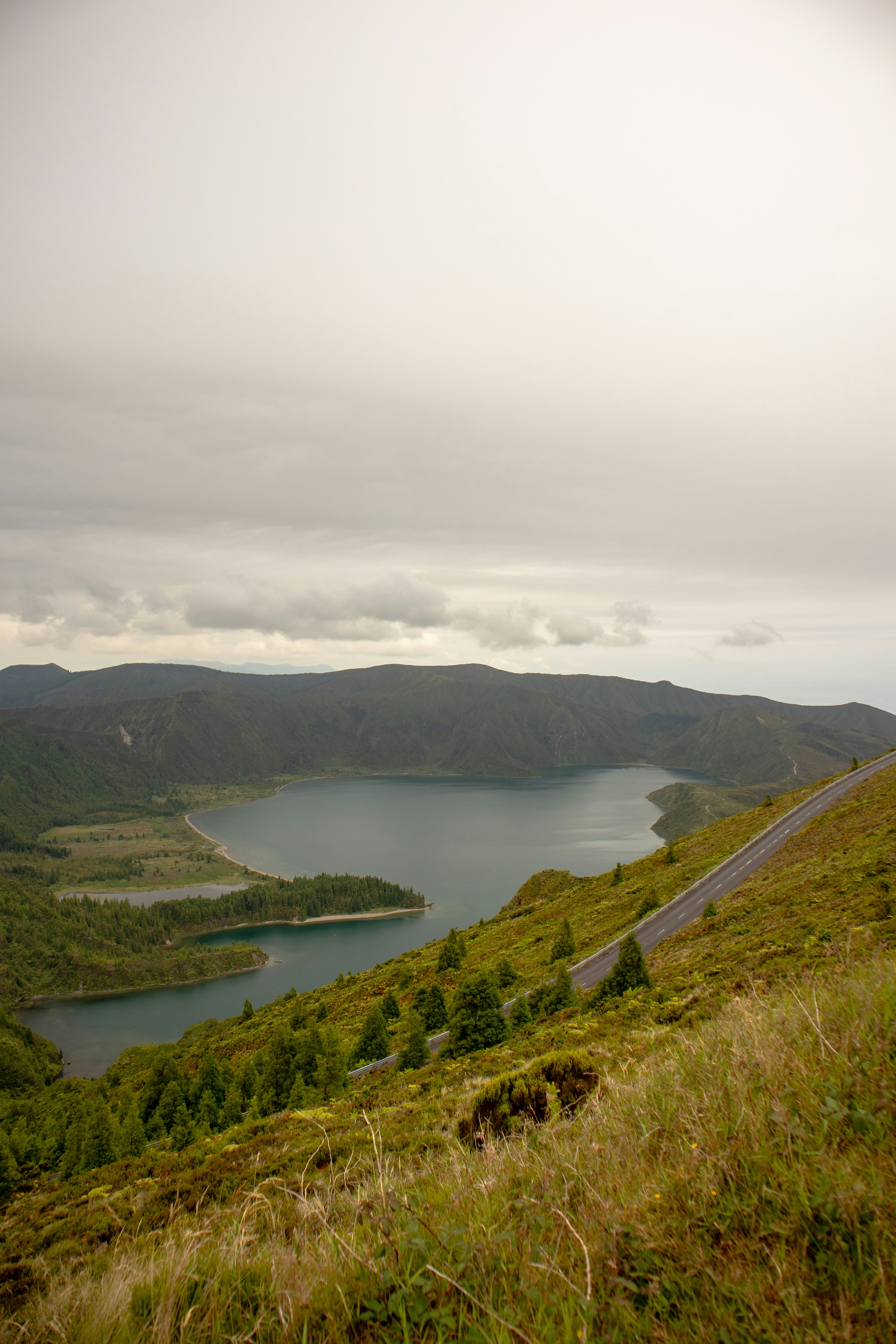 Emerald Reservoir Fold: A Winding Road Descends toward Quiet Waters
