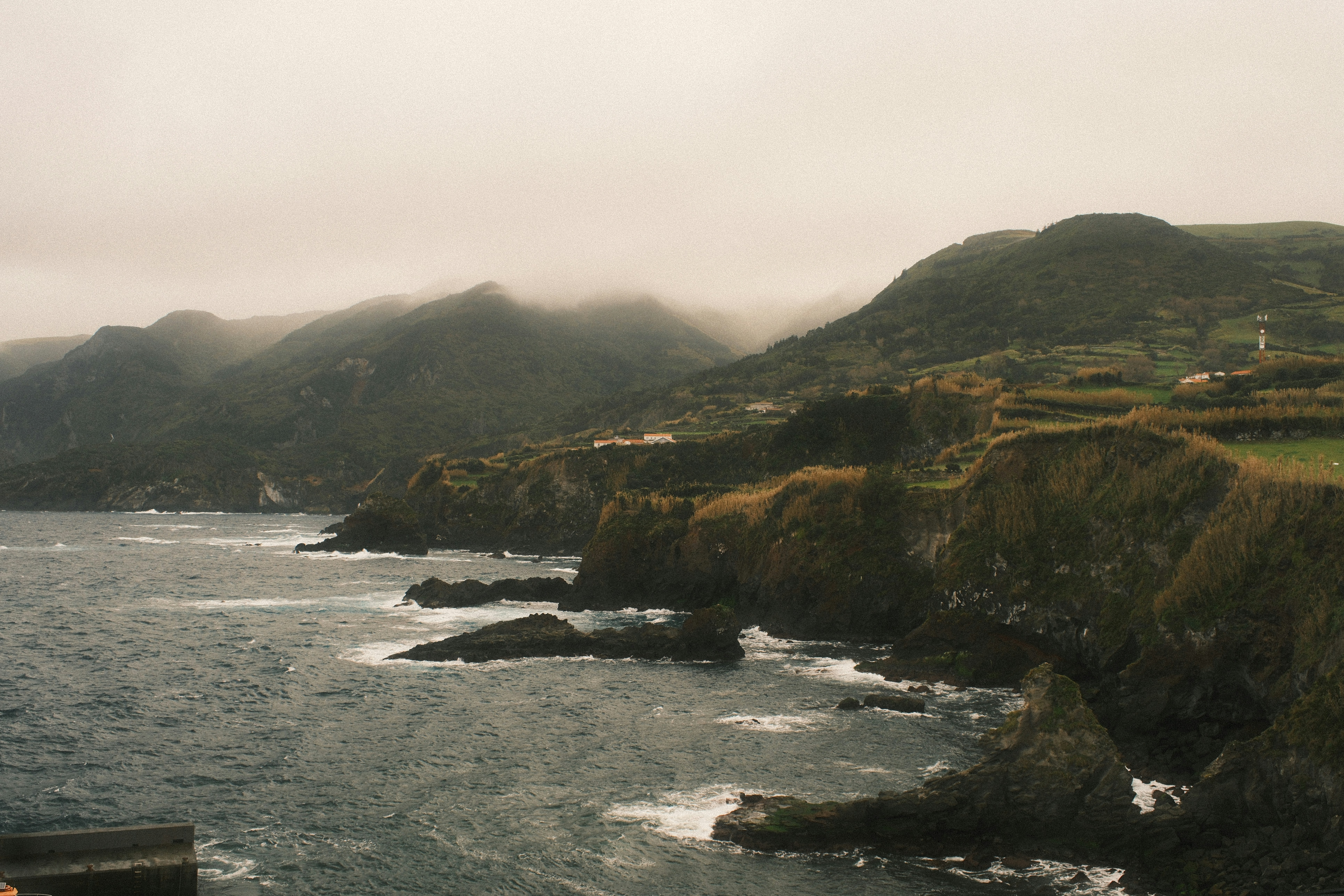 Coastal Edge and Mist: Windswept Cliffs Under a Quiet Horizon