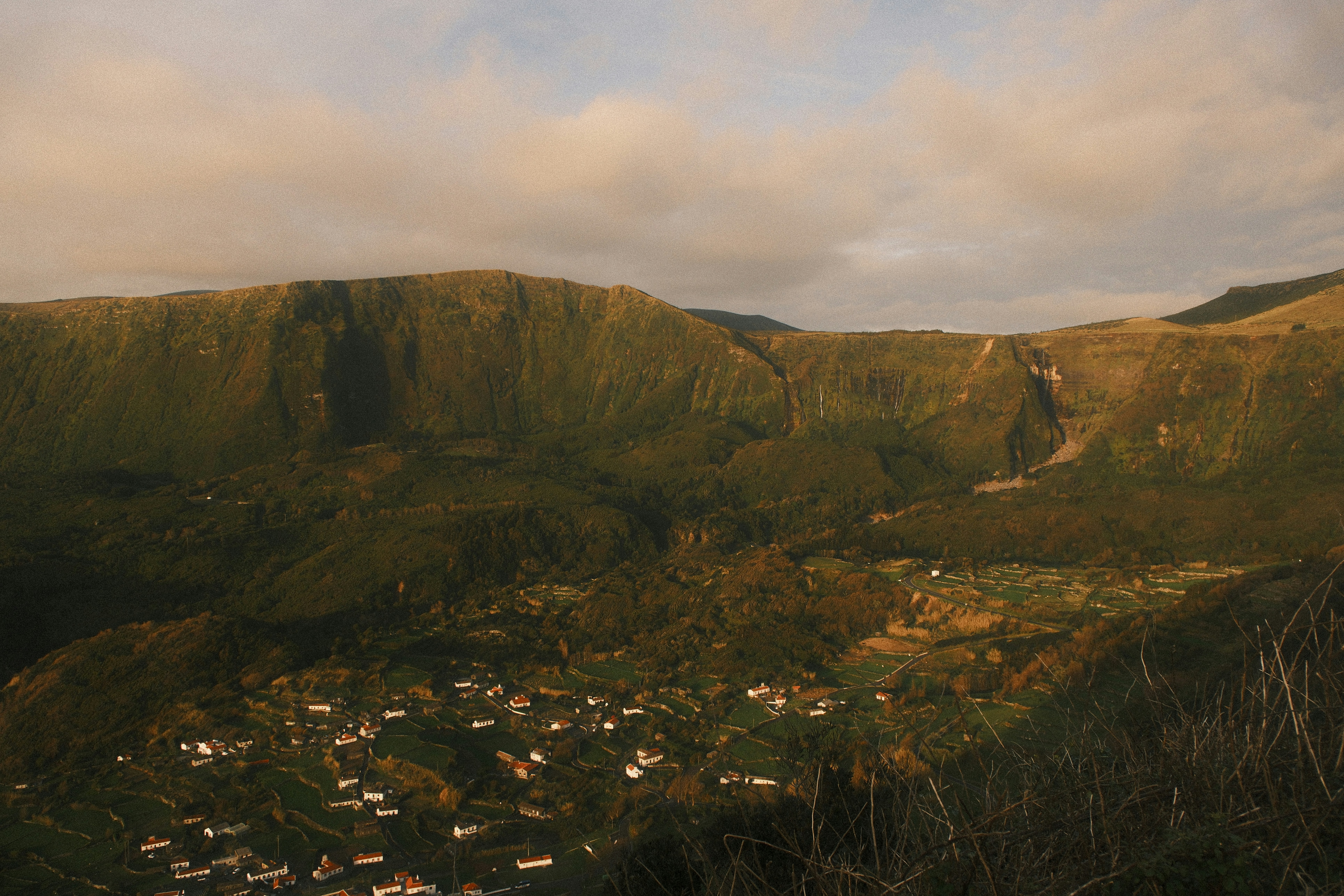 Cliffside Valley at Dusk: A Quiet Village Hidden in the Hills