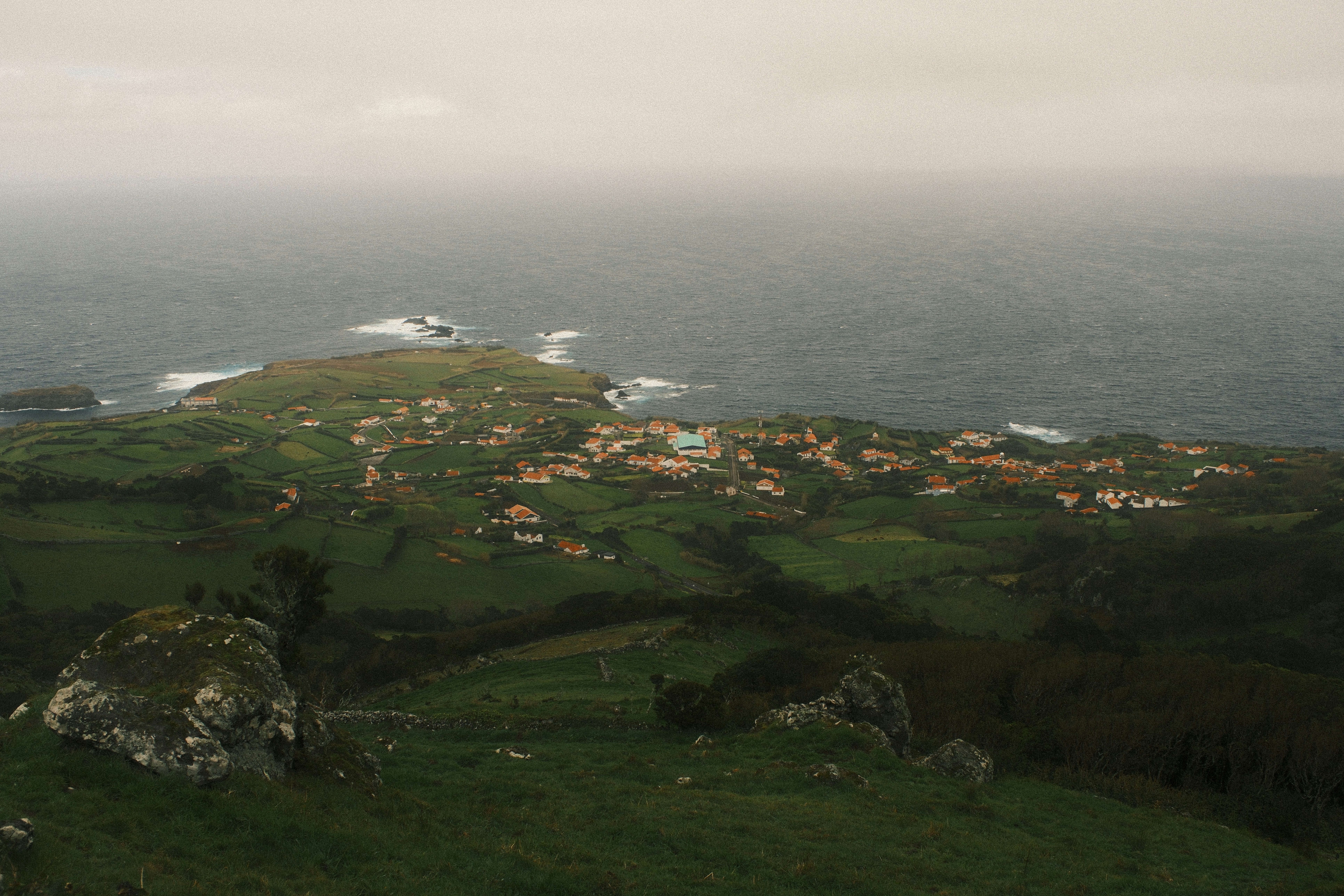 Clifftop Village Beneath a Misty Atlantic Horizon