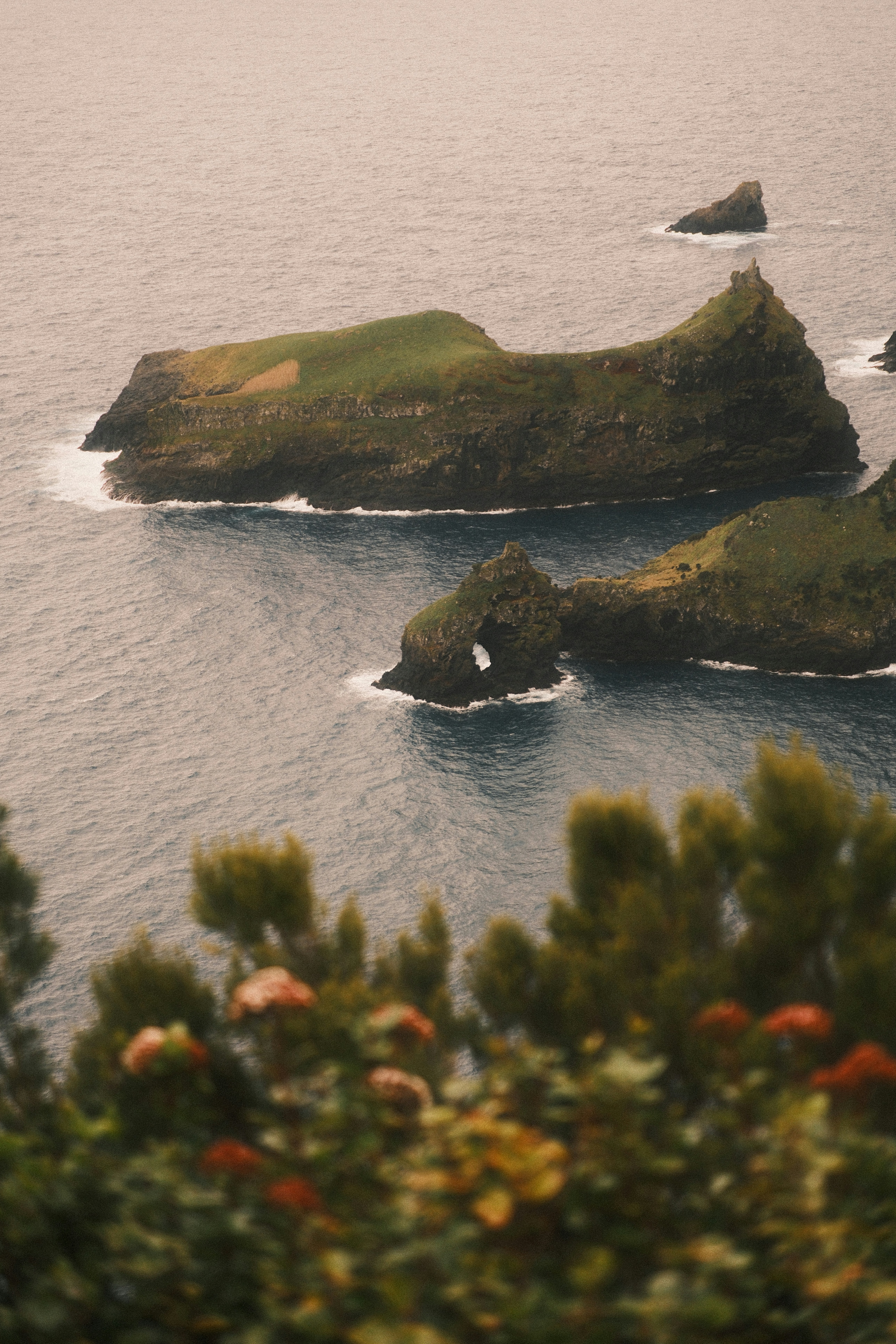 Lone Greenlandic Archipelago slice rising from a tranquil sea