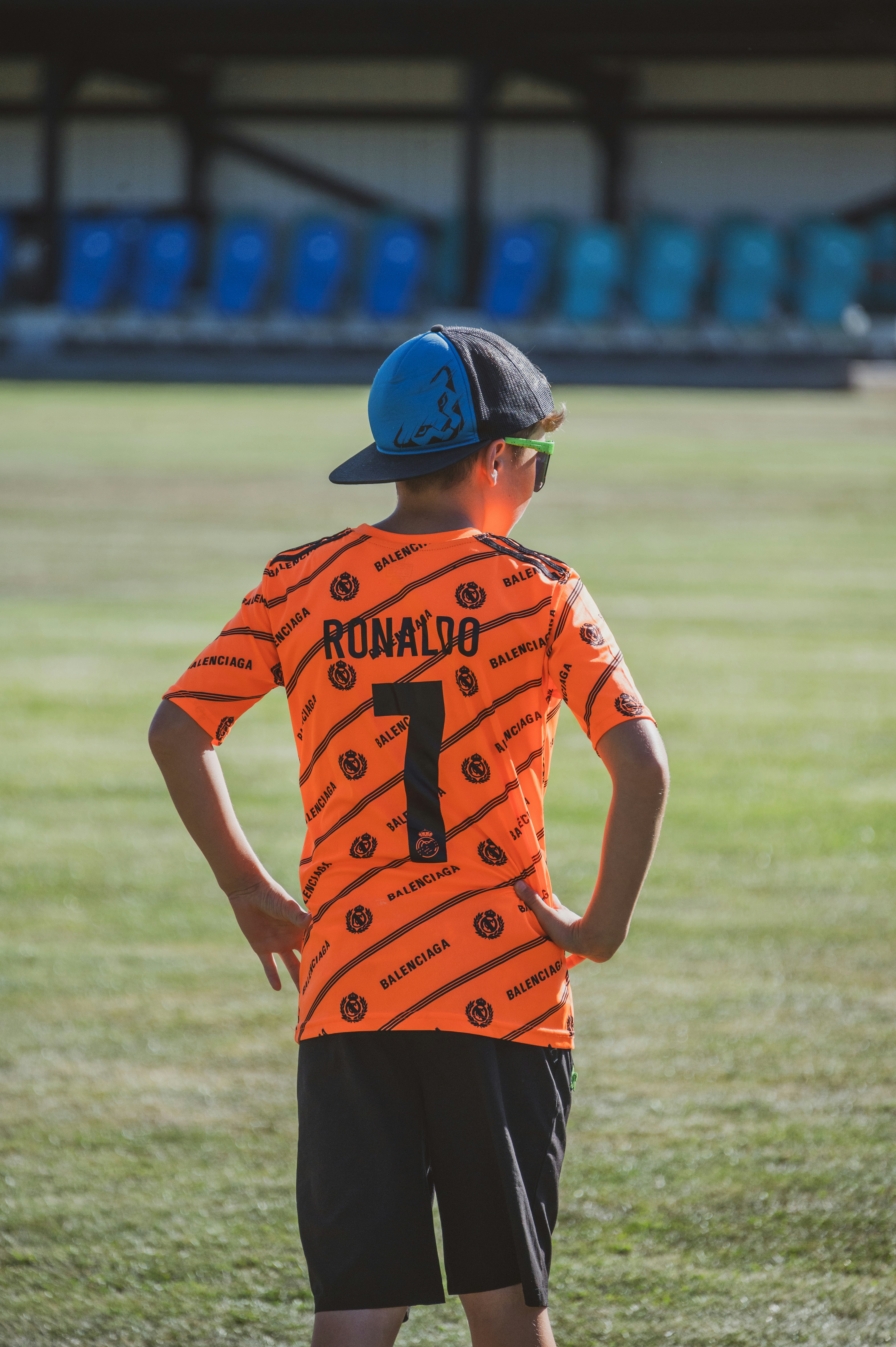 Rising Striker: A Kid in Bright Gear on the Field