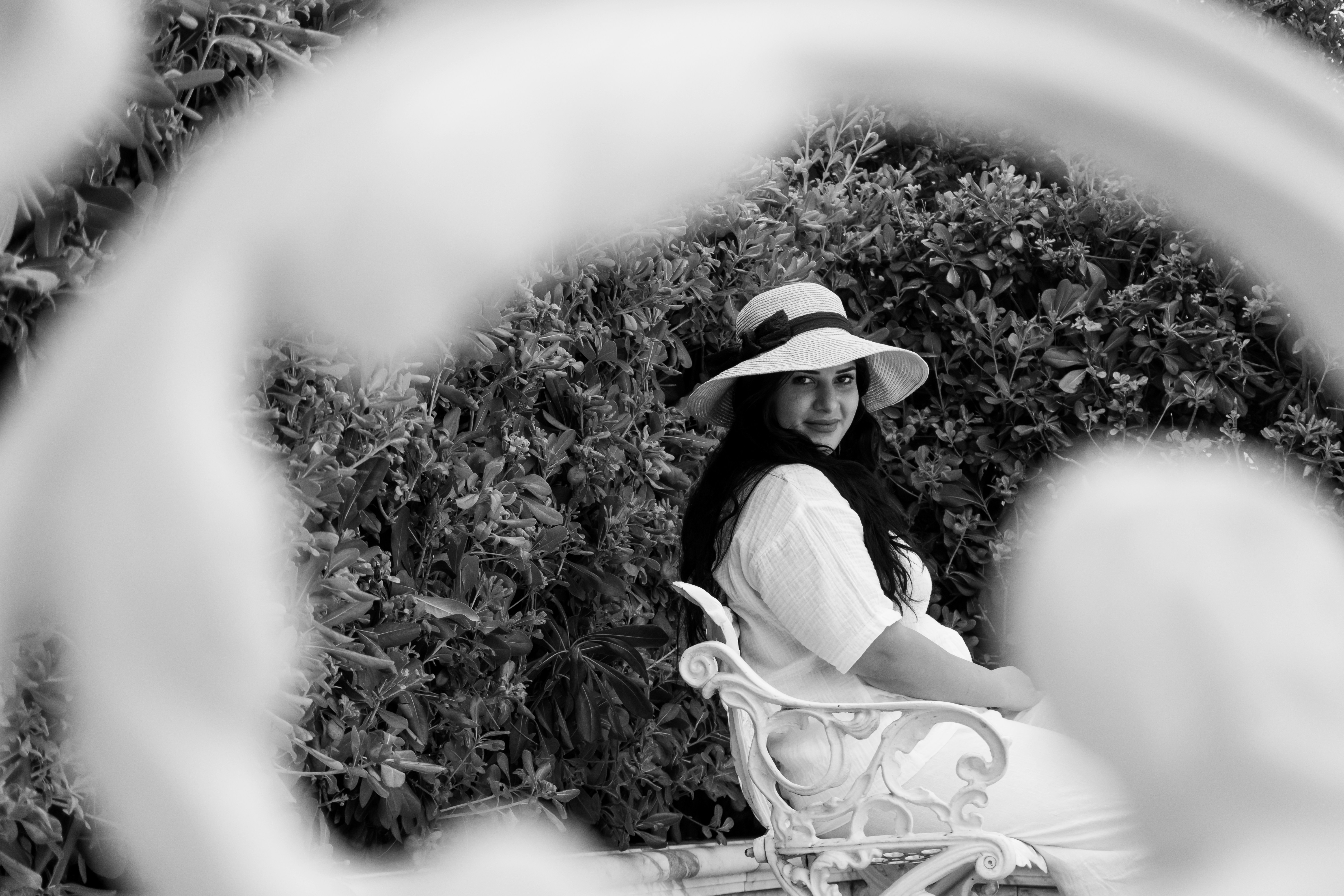 Garden Solitude: A Quiet Pose Through the Arch