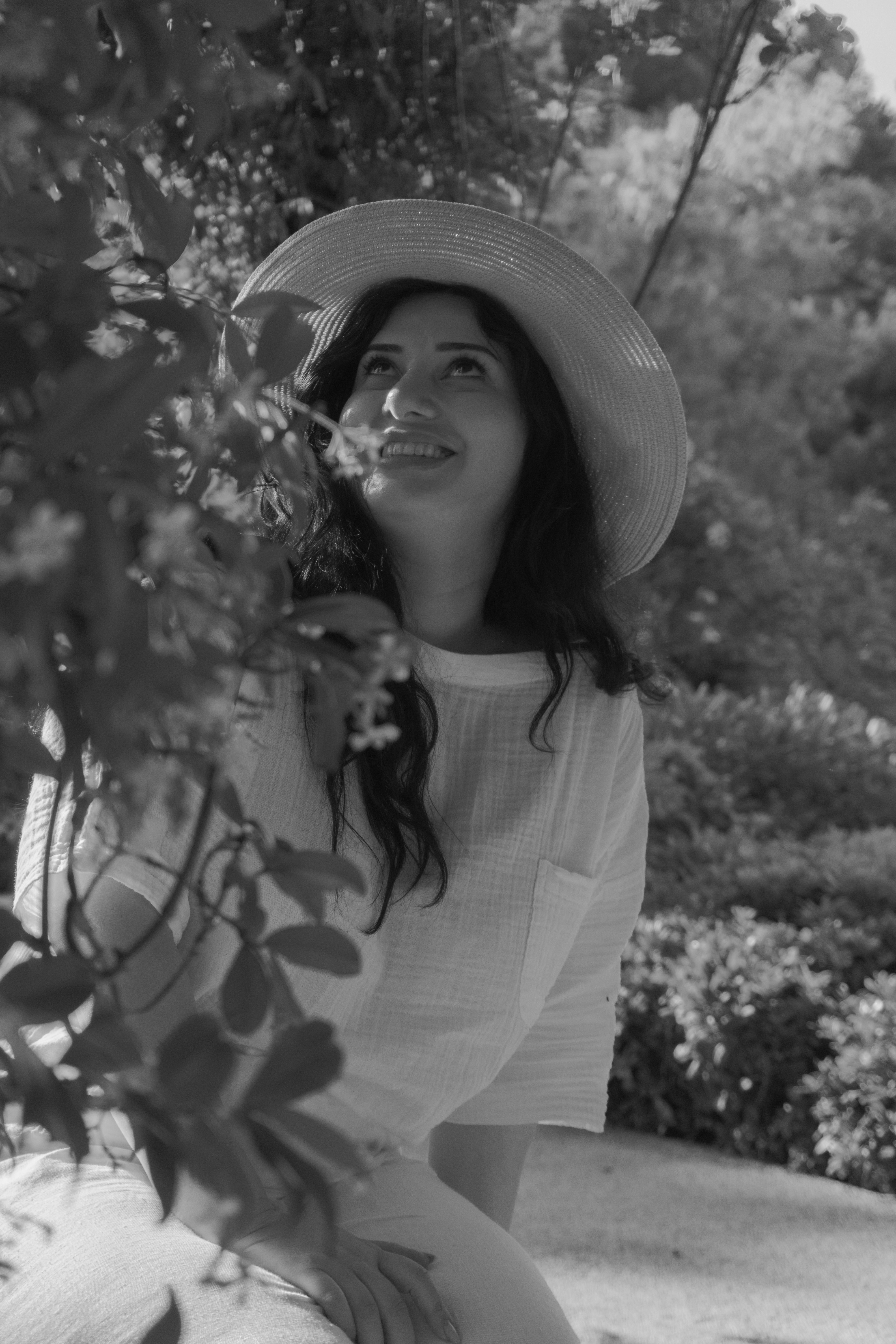 Sunlit Smile Behind the Garden Leaves
