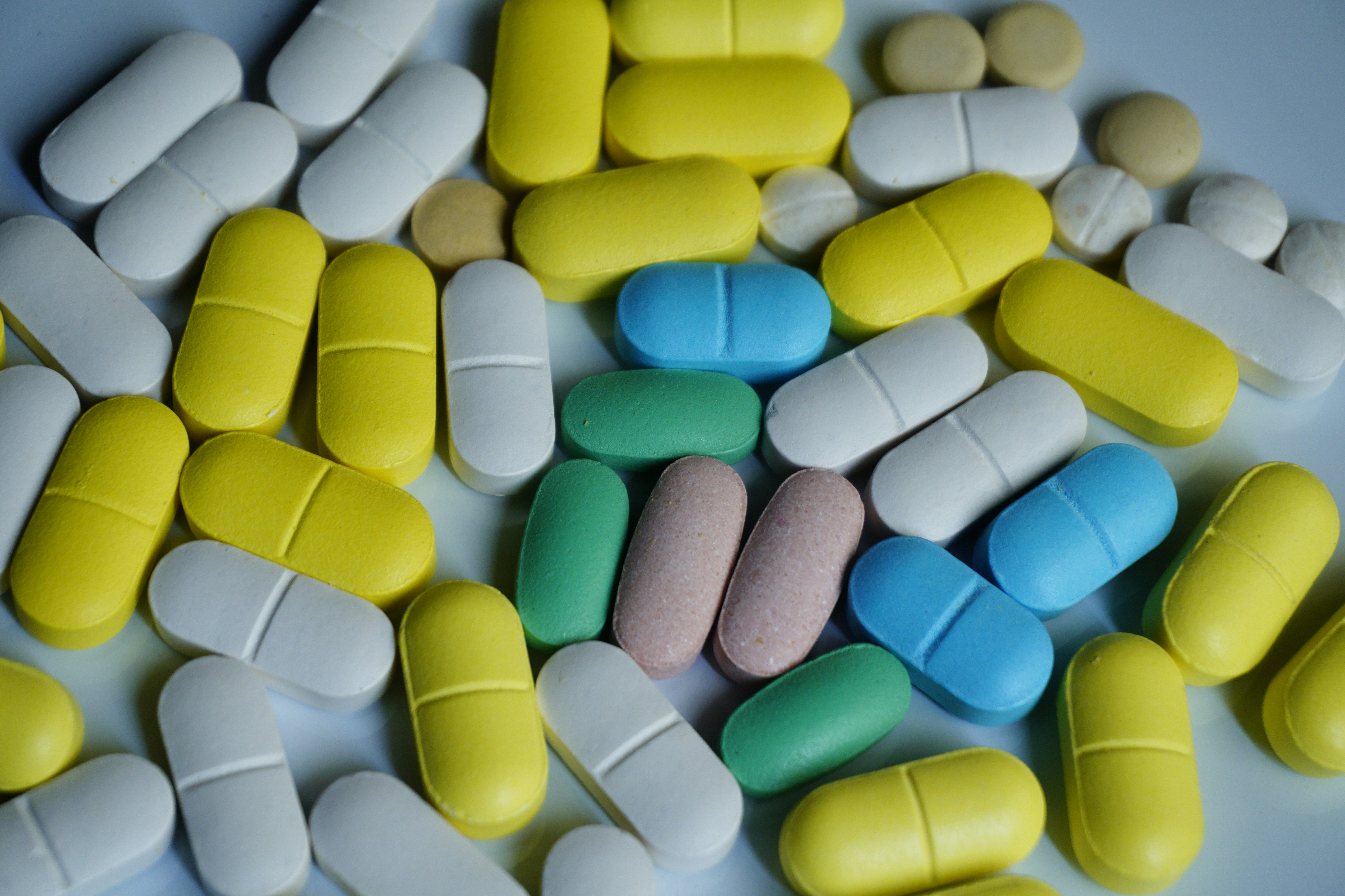 Colorful Pill Mosaic: A Close-Up of Assorted Capsules and Tablets