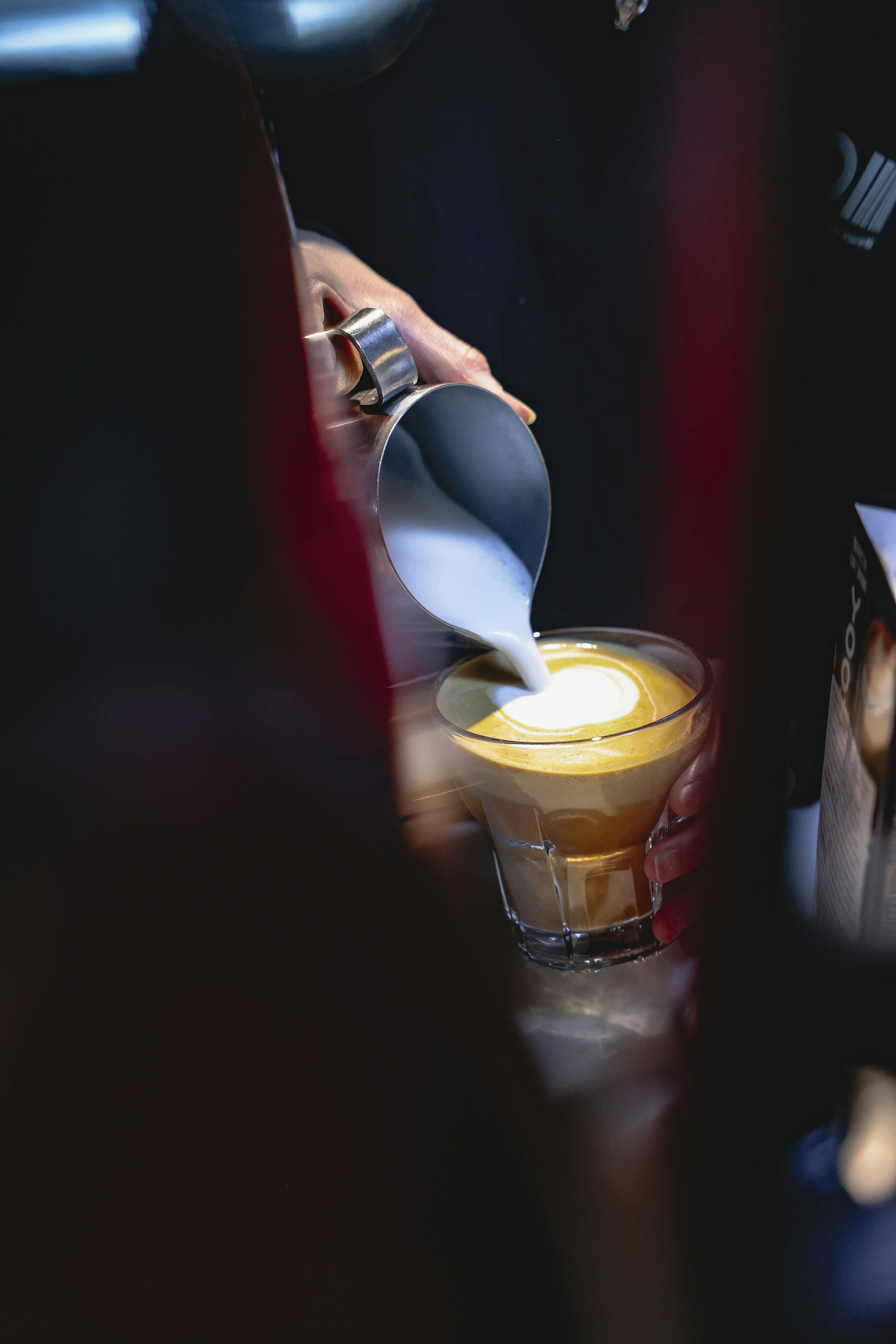 Creamy Microfoam in a Barista’s Hand