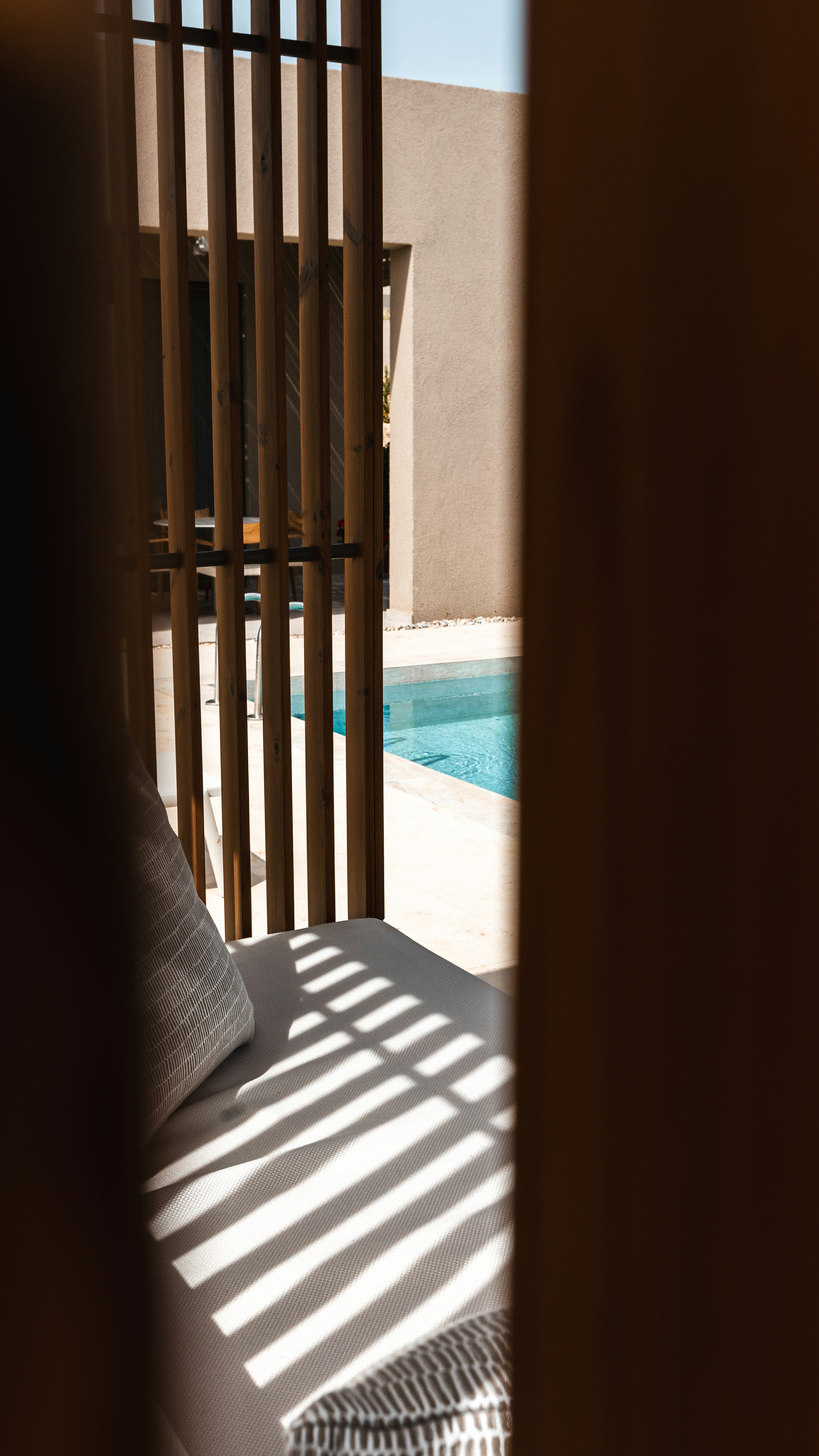 Shadows and Slats: Framed by a Poolside Gap