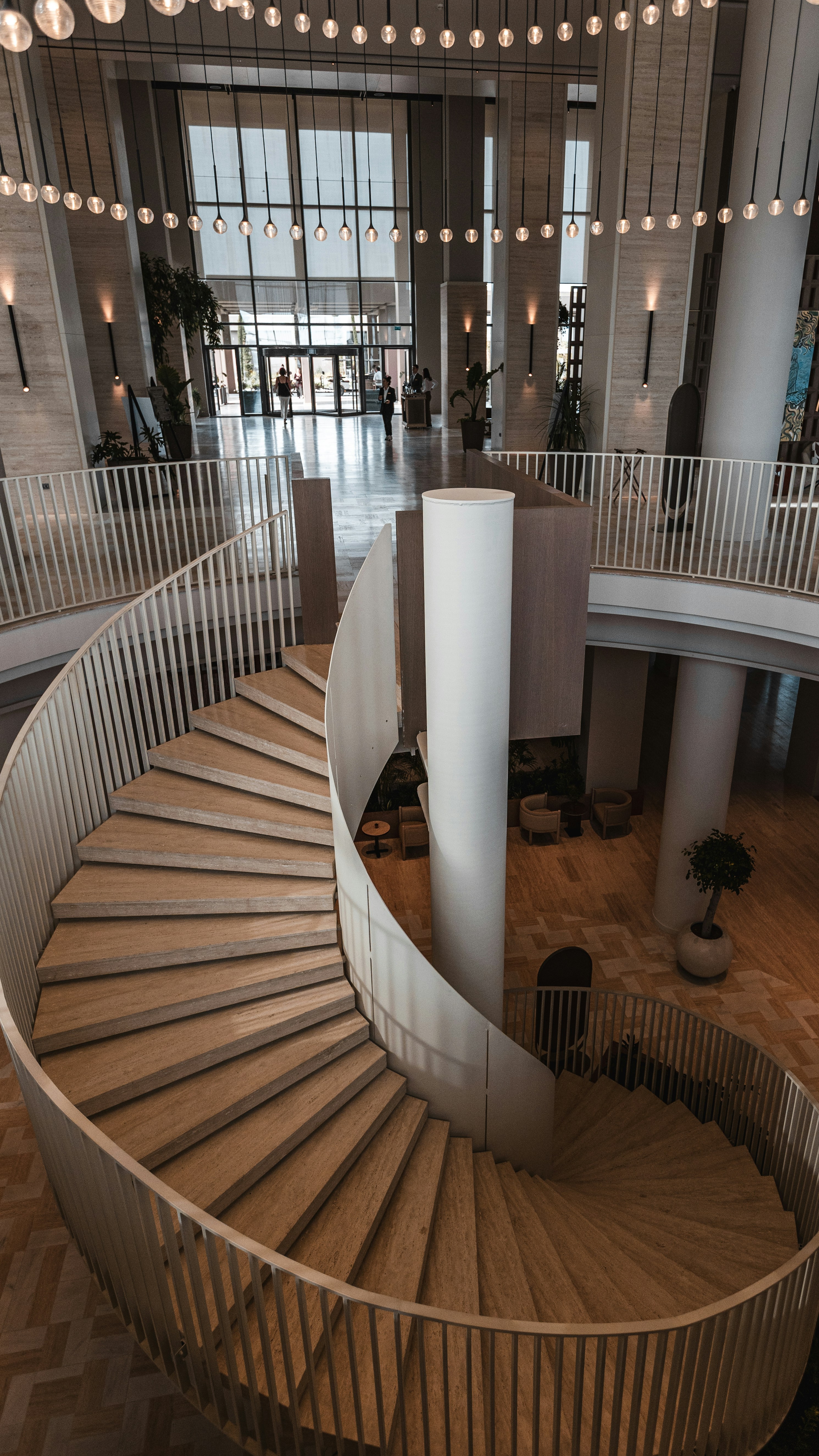Central Helix: A Grand Spiral Staircase in a Sunlit Atrium