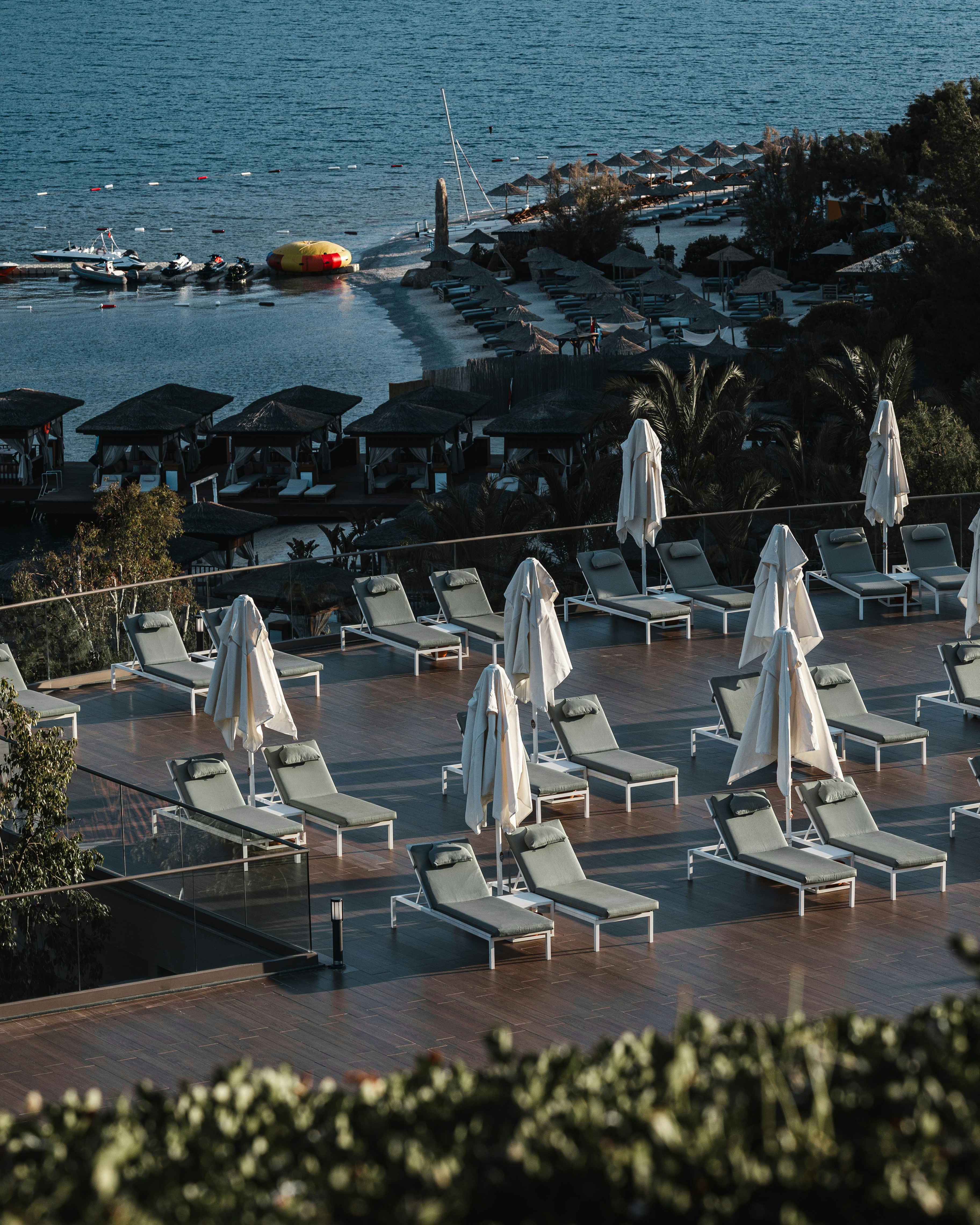Sunlit Lounge Rows Overlook a Tranquil Sea