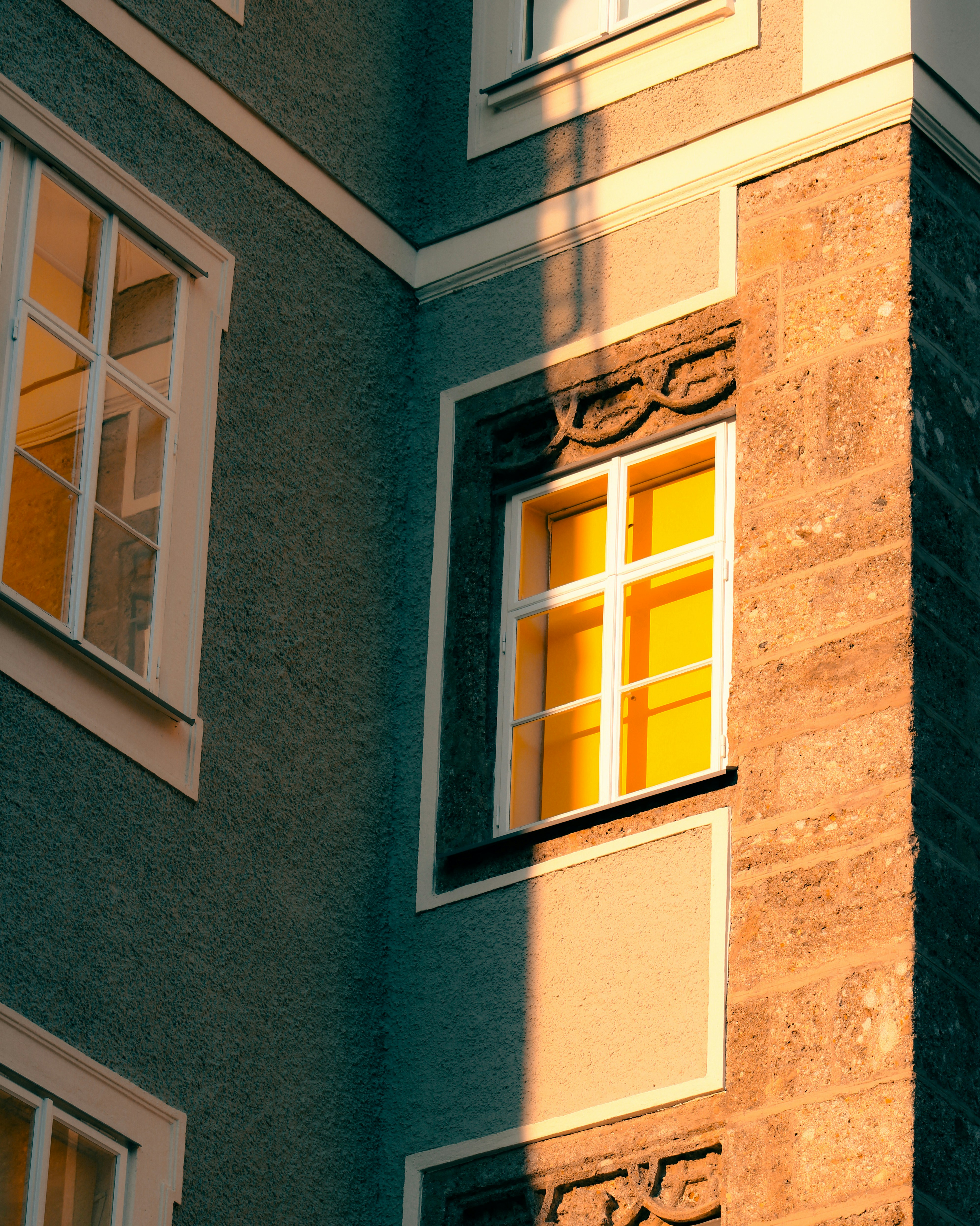 Sunlit Window Corner: Architecture in Warm Shadow