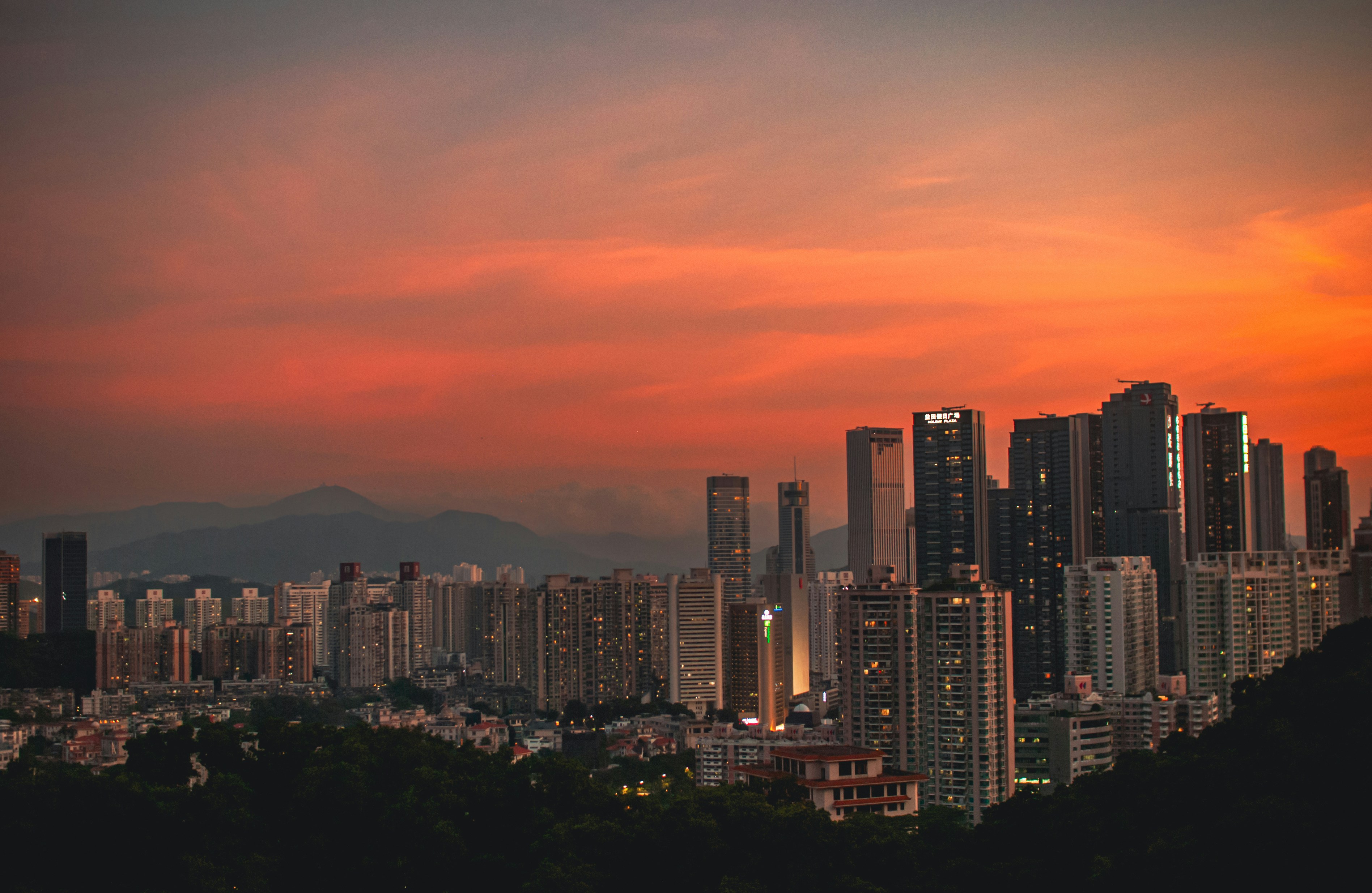 Crimson Horizon Over a Listening City
