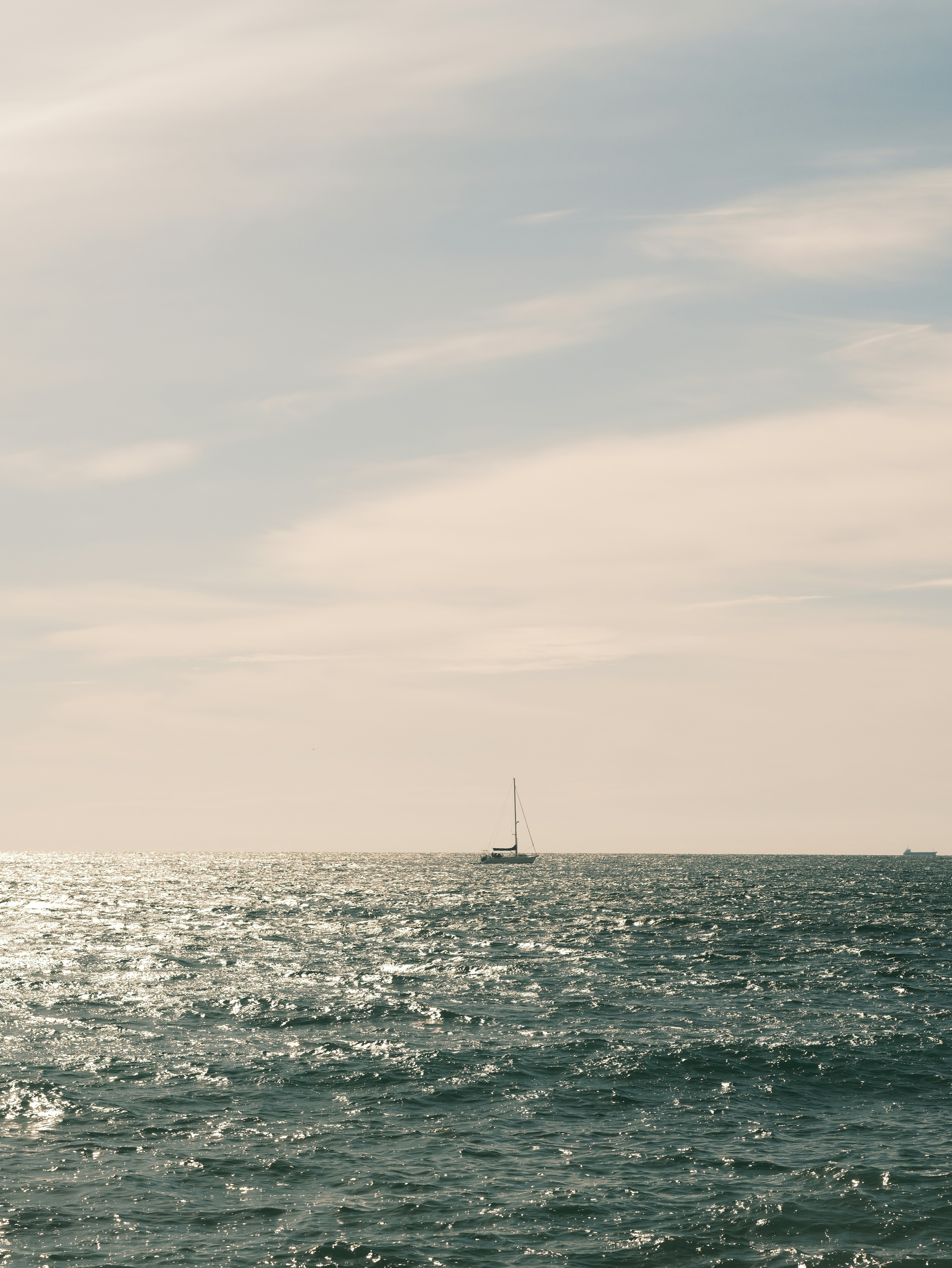 Solo Sailer on a Quiet Horizon