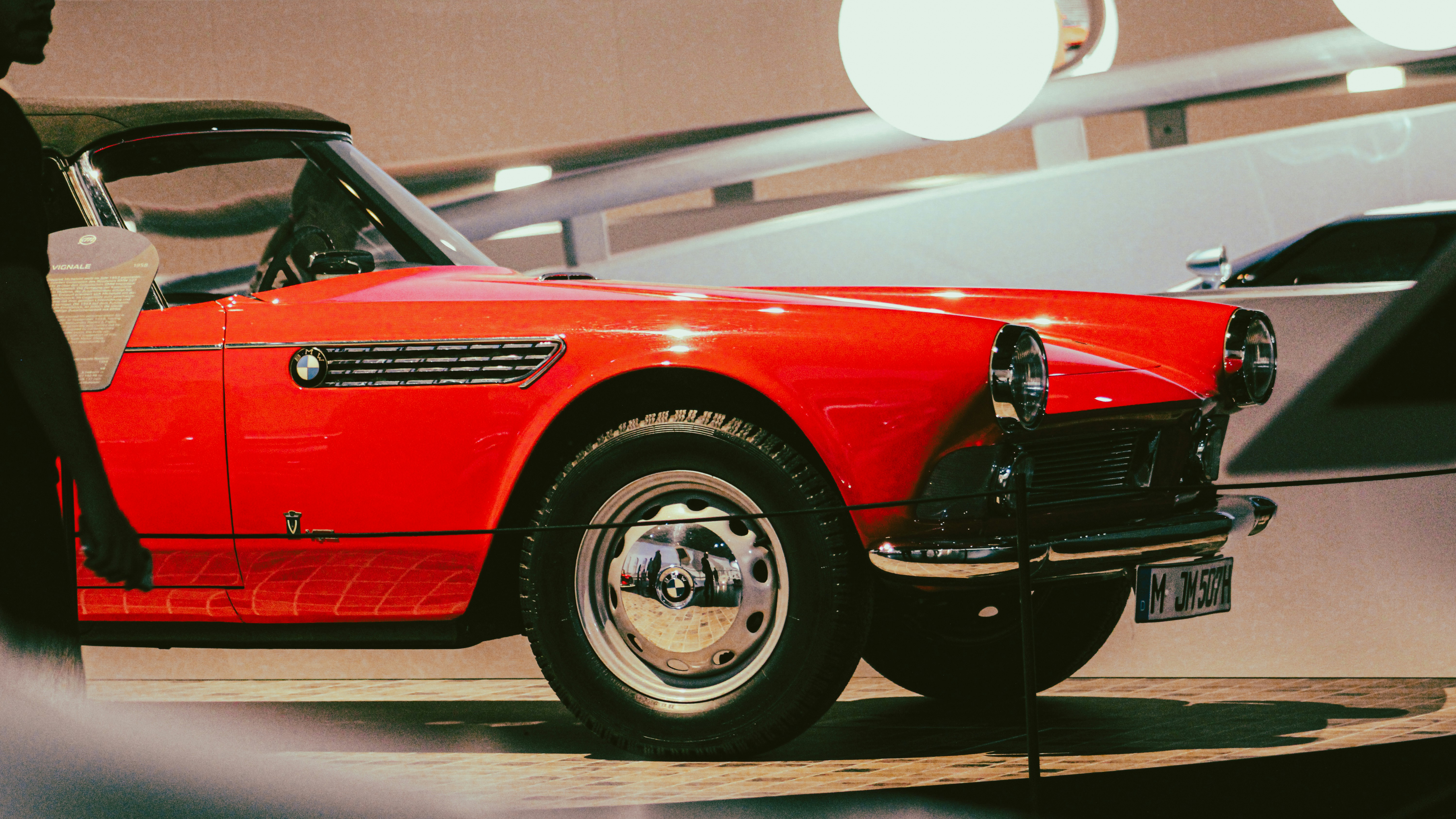 Crimson Classic: A Snap of a Red Convertible in Studio Glow