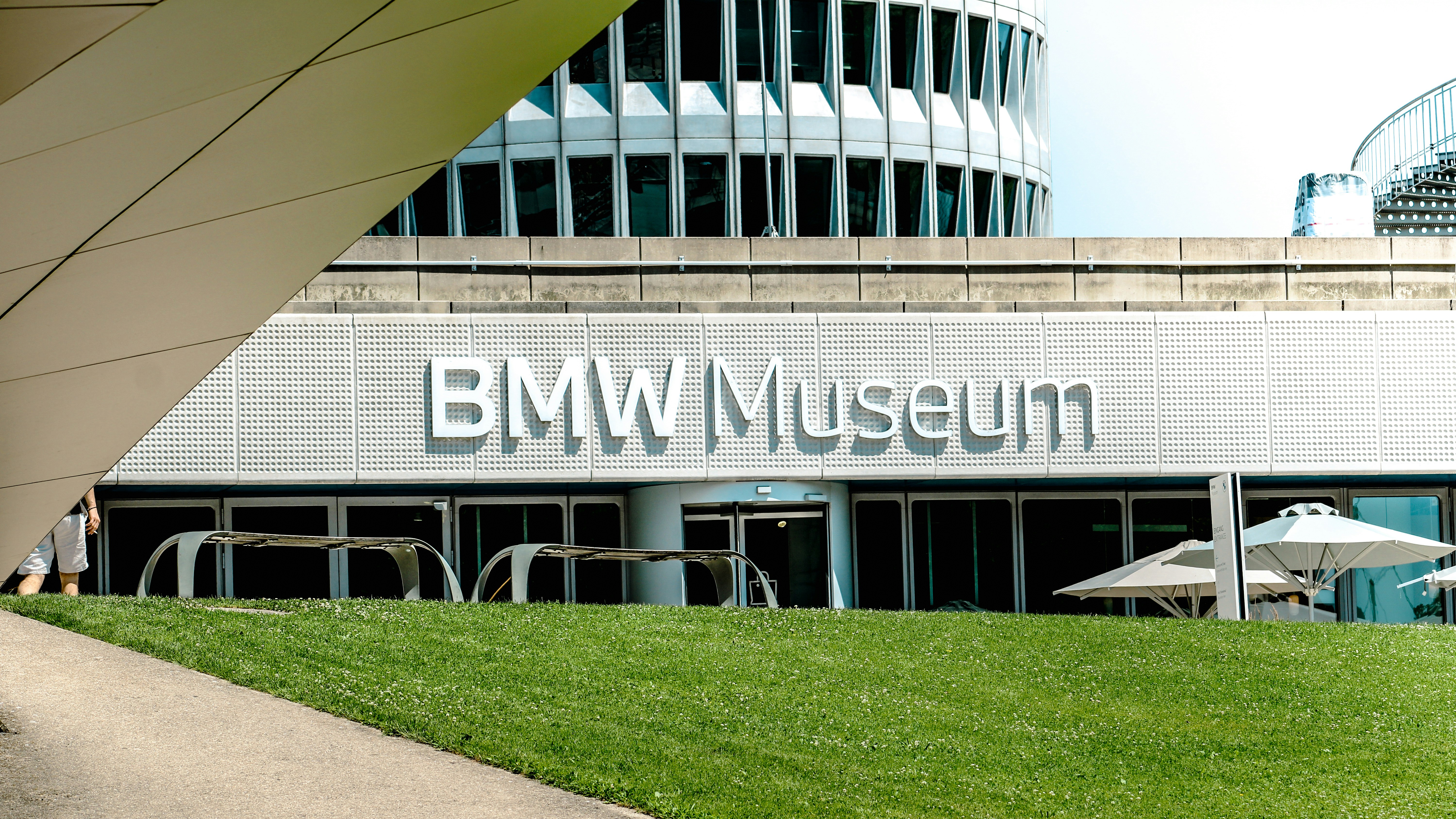 BMW Museum Facade: Modern Curves Meet Green Lawn