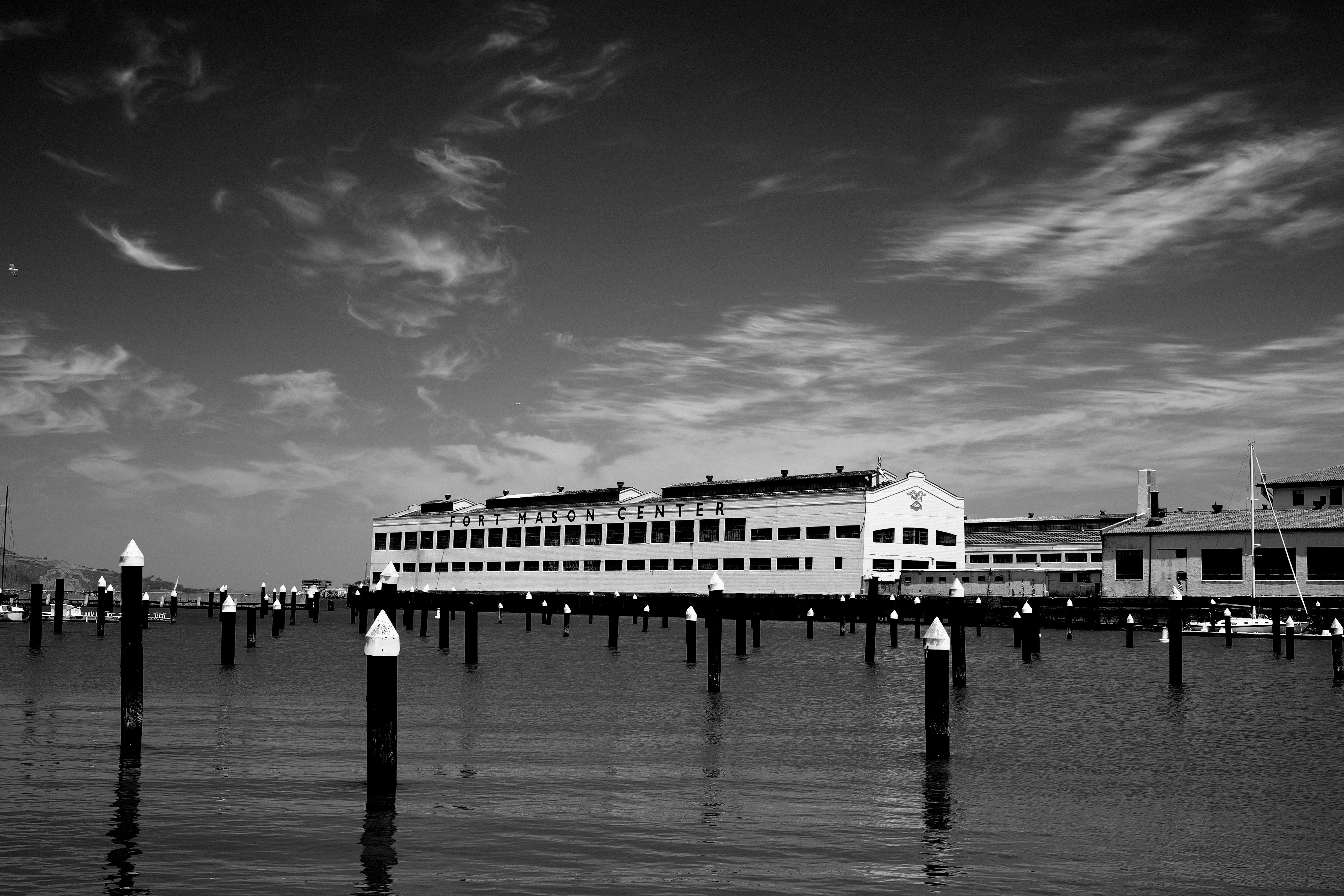 Harbor Pierhead at Dusk: A Monochrome Wharf's Quiet Expanse