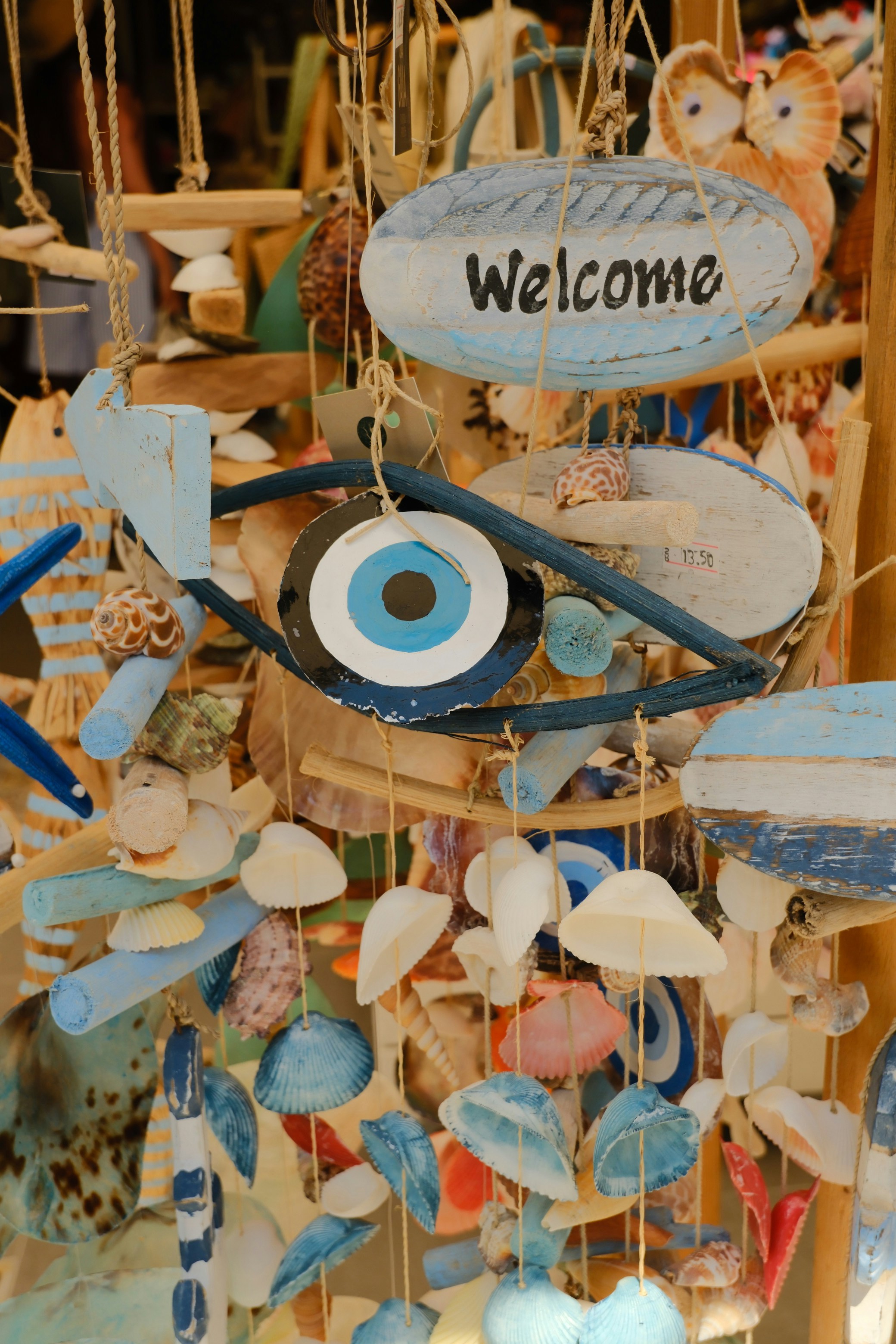 Blue Welcome Sign Enveloped by Coastal Ornaments
