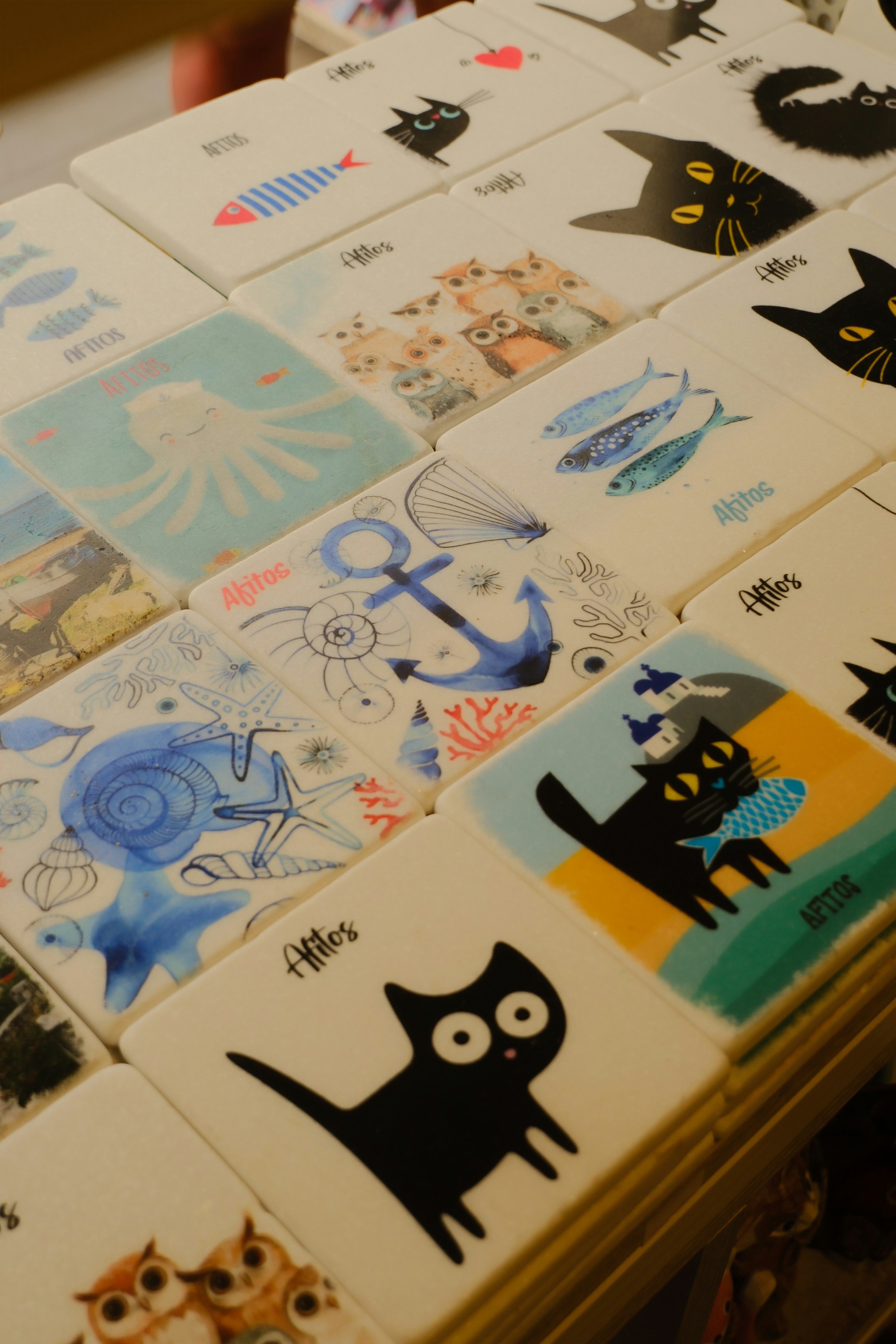 Playful Tiles: Black Cat Icons Amid Colorful Illustrations