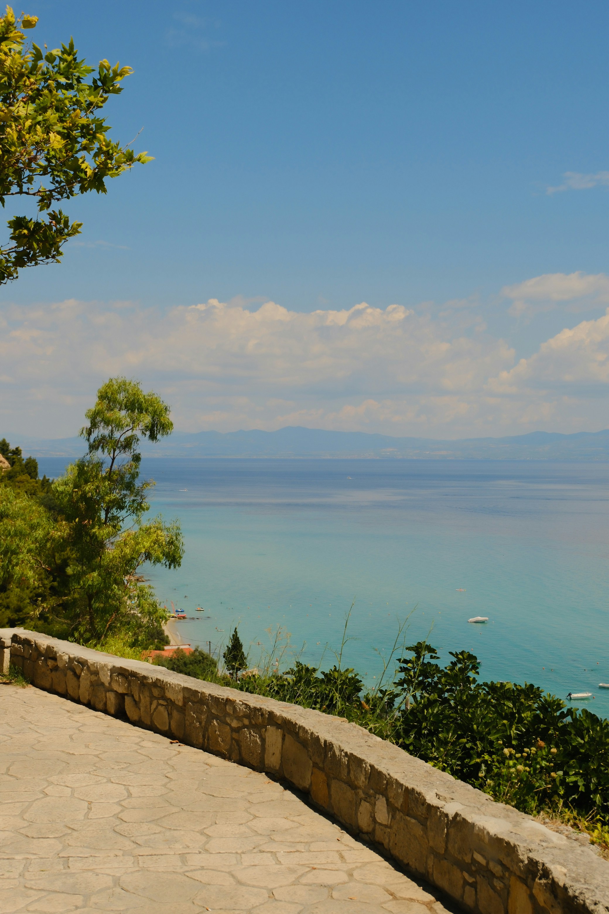 Sea Cliff Promenade: A Sunlit Path Beside Turquoise Waters