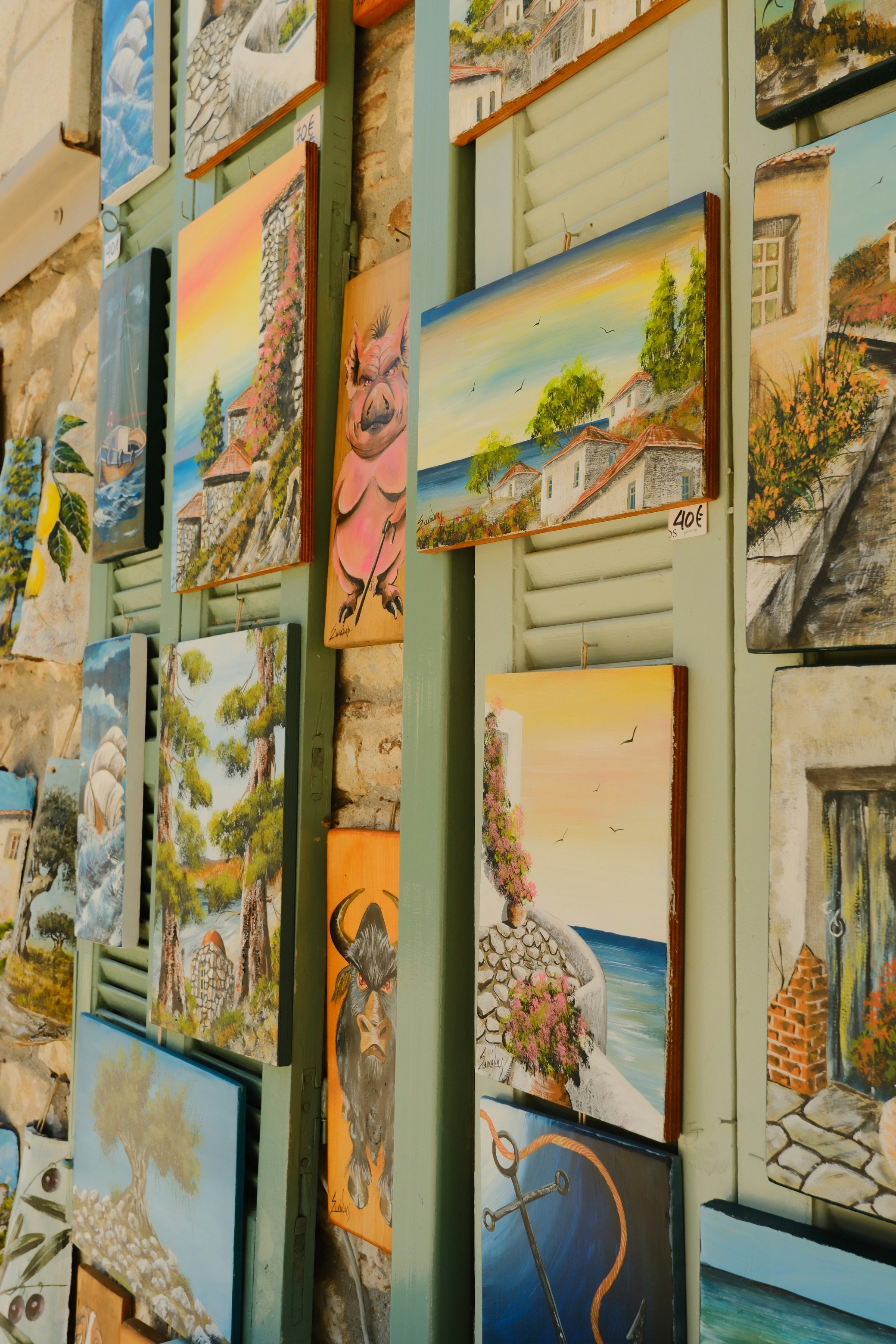 Colorful Gallery of Coastal Villages: Painted Moments on a Stone Wall