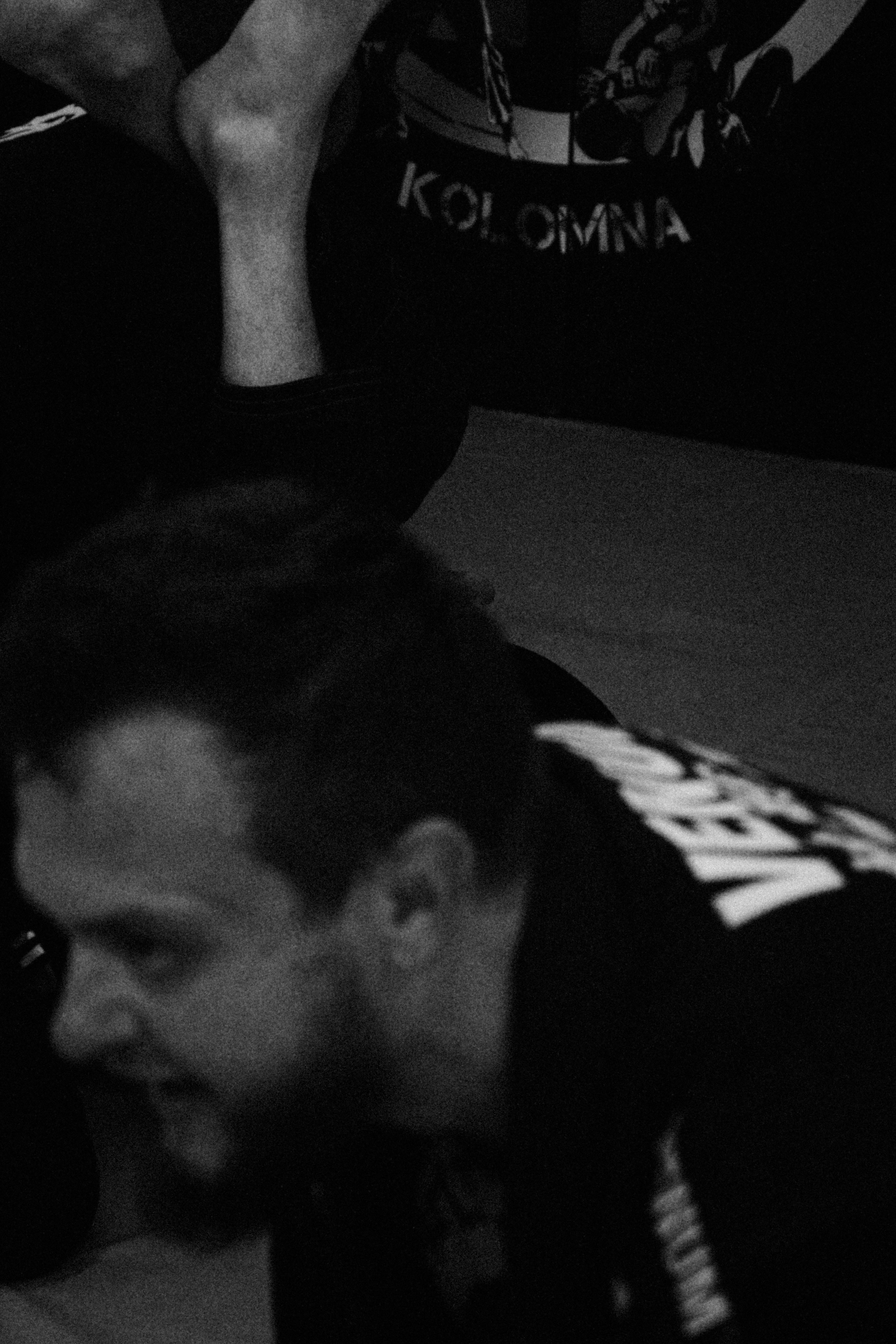 Low‑Light Grasp: A Contorted Moment in Black and White